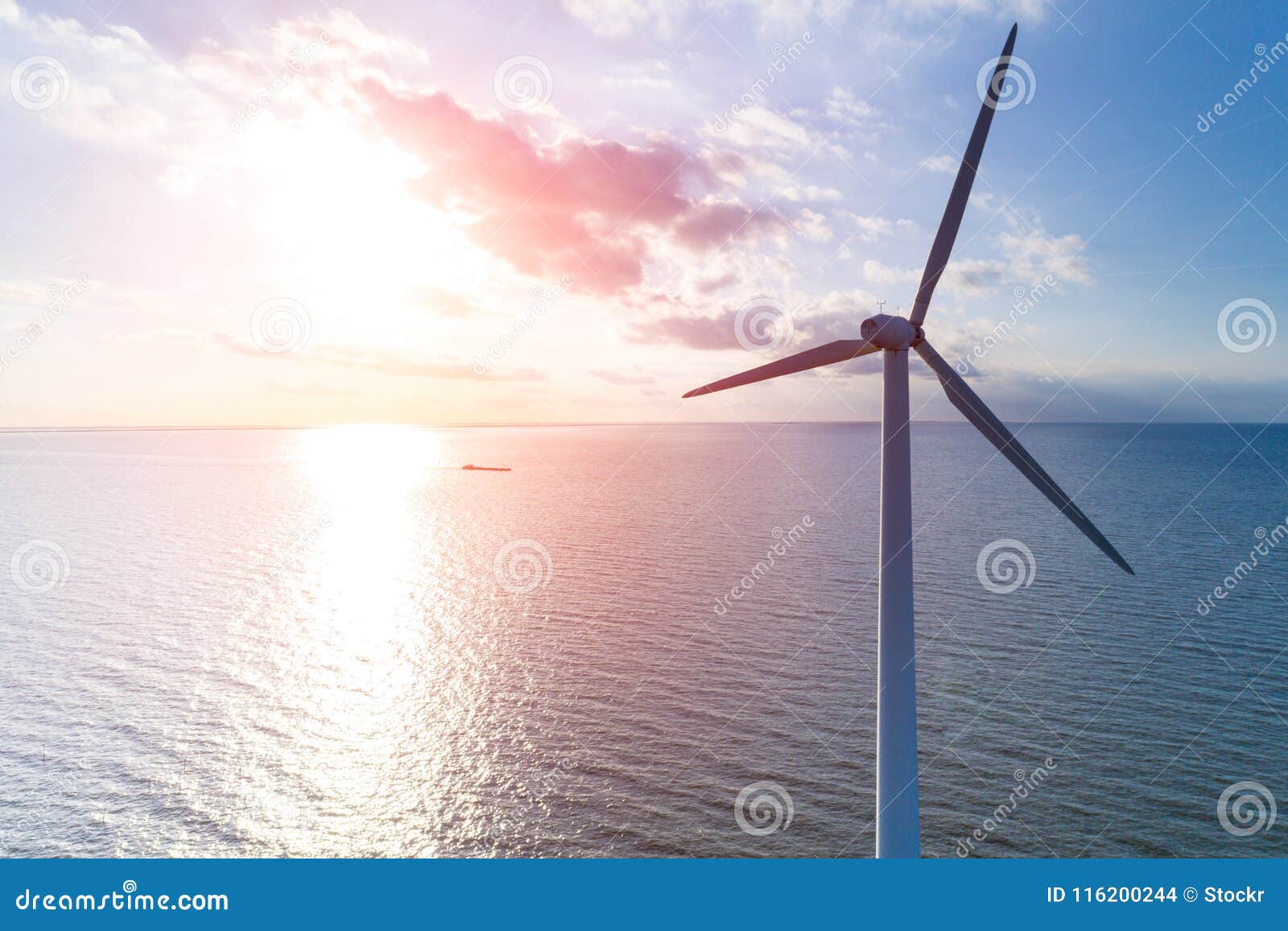 Sunset Above the Windmill in the Ocean Stock Photo - Image of green ...