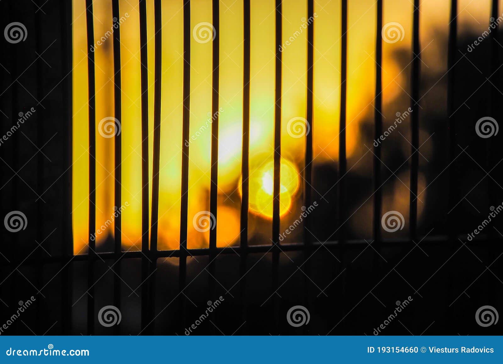 Beautiful Sunset Behind the Metal Bars, Defocused Stock Photo - Image ...