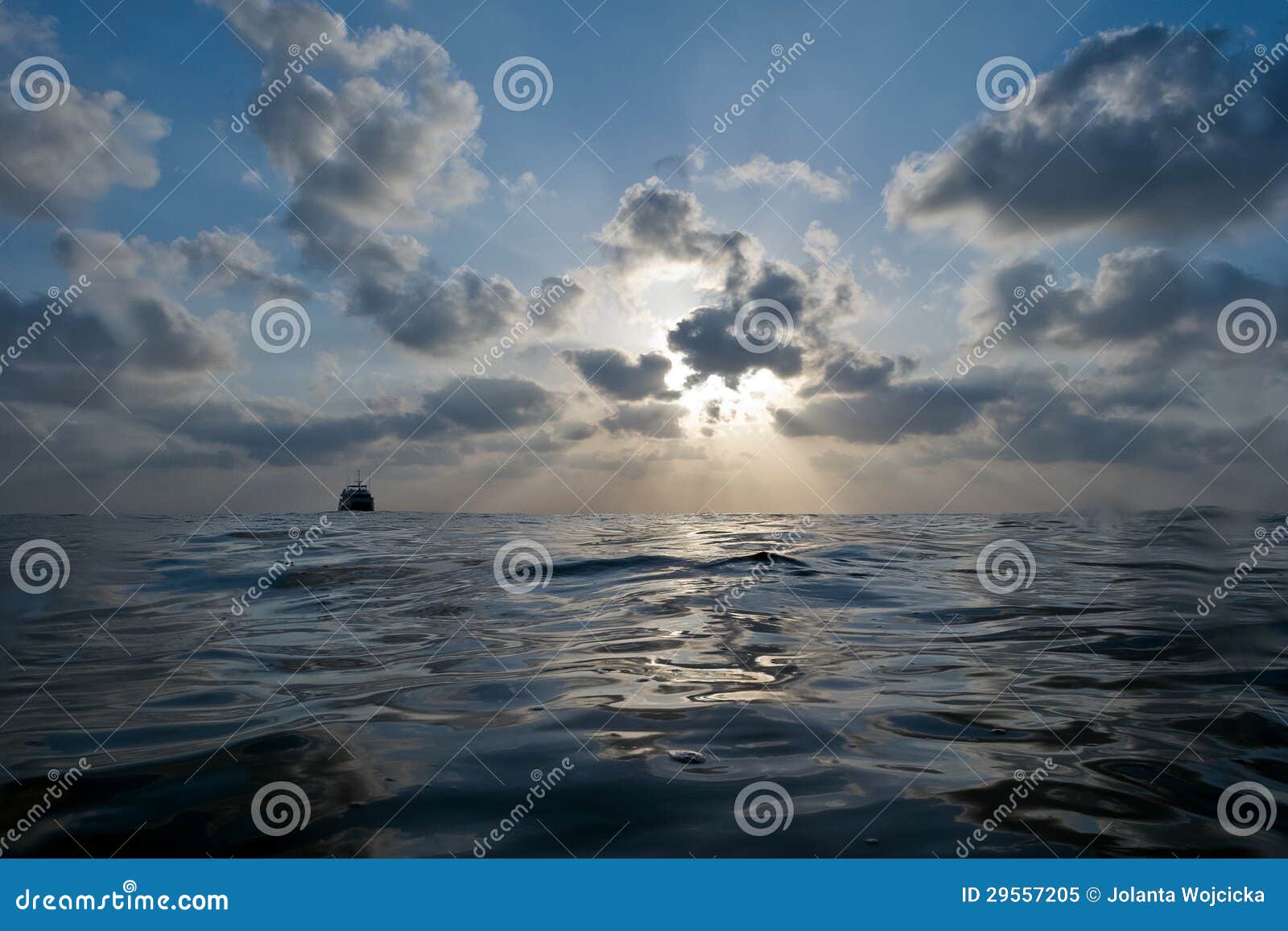 Beautiful Sunset with Cloudy Blue Sky Over the Water of Sea Stock Image ...