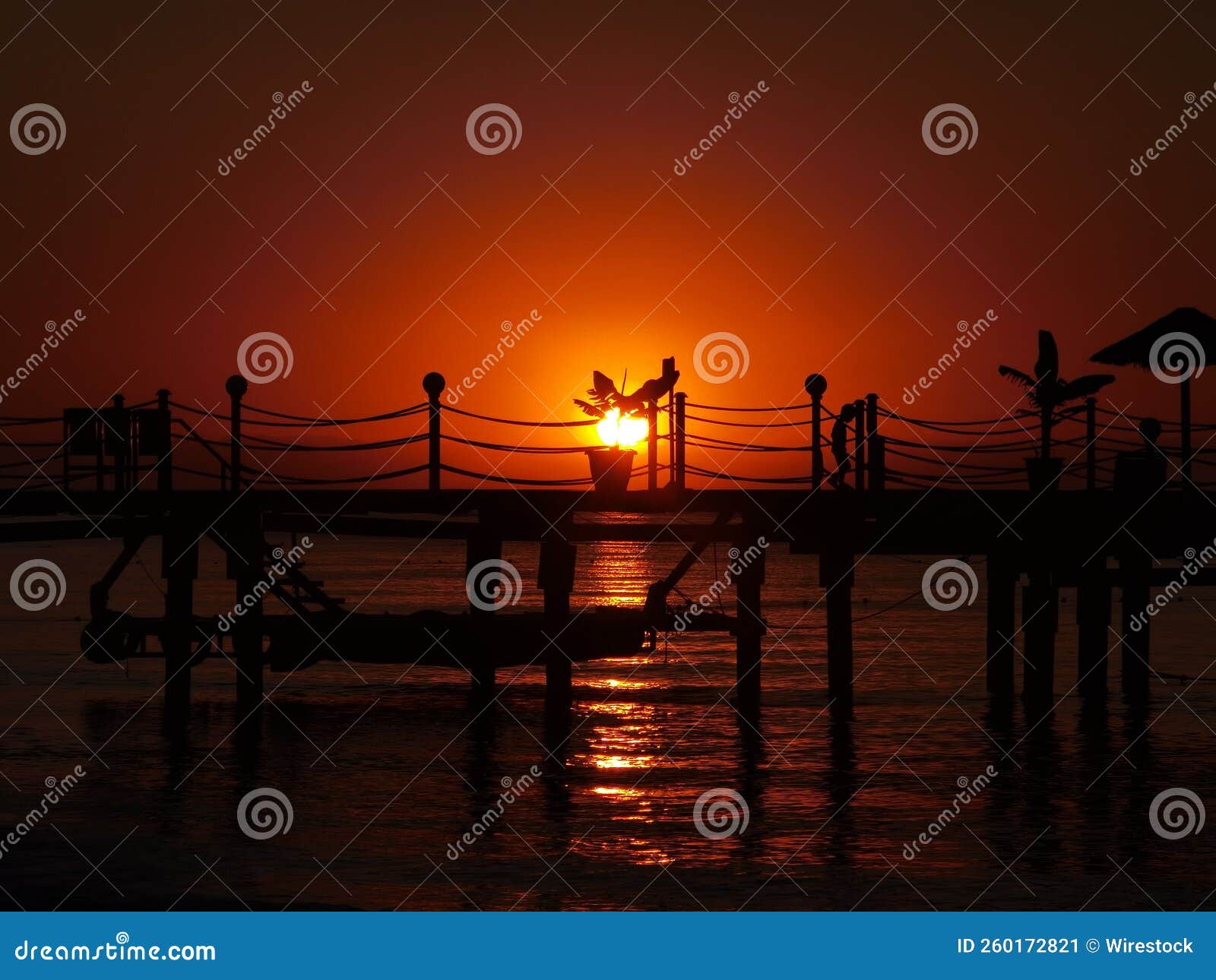 Beautiful Sunset at a Dock with the Sunlight Reflected in the Water ...