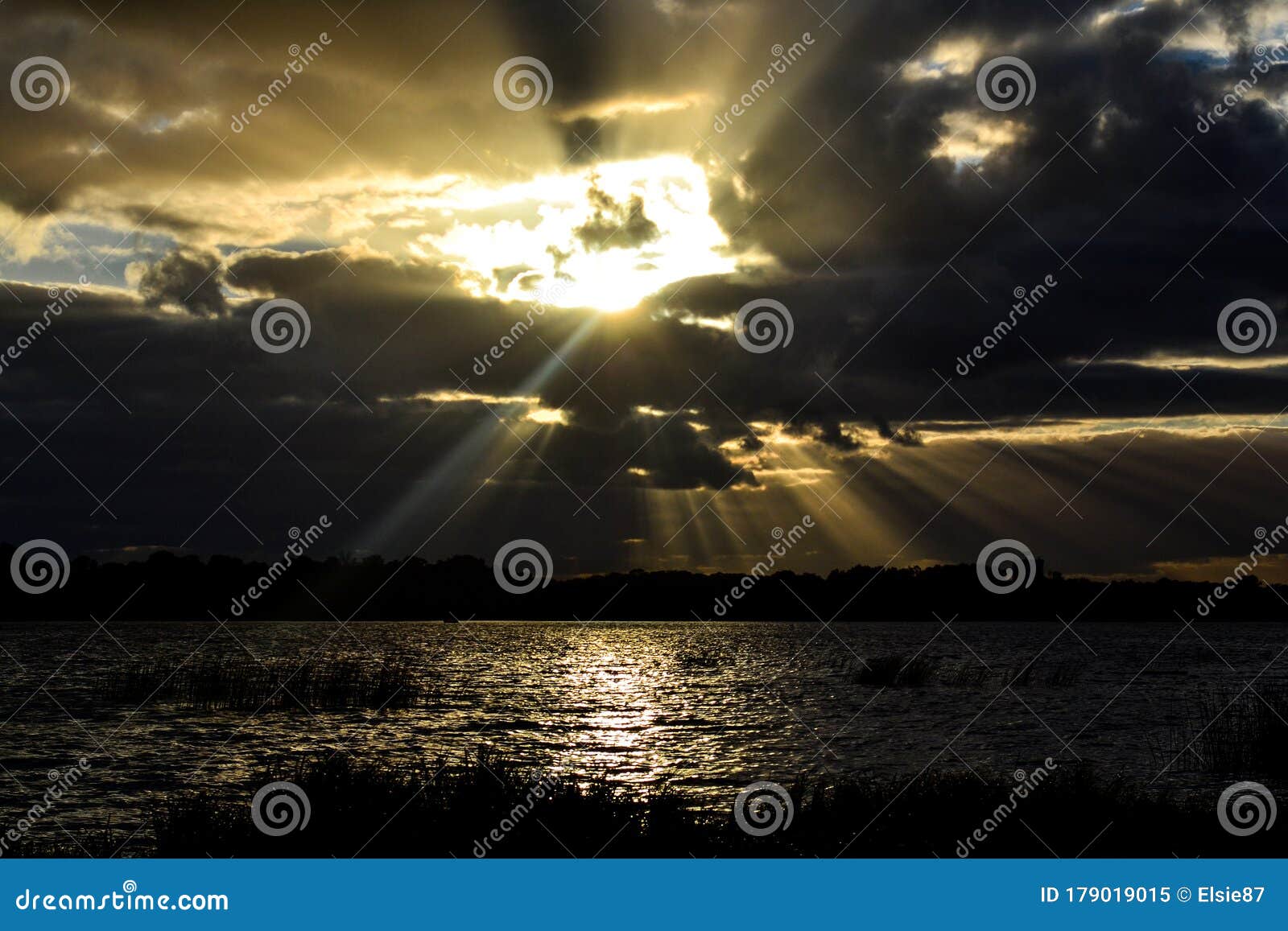 Beautiful Sunset Landscape with Sun Rays Shining through the Clouds ...