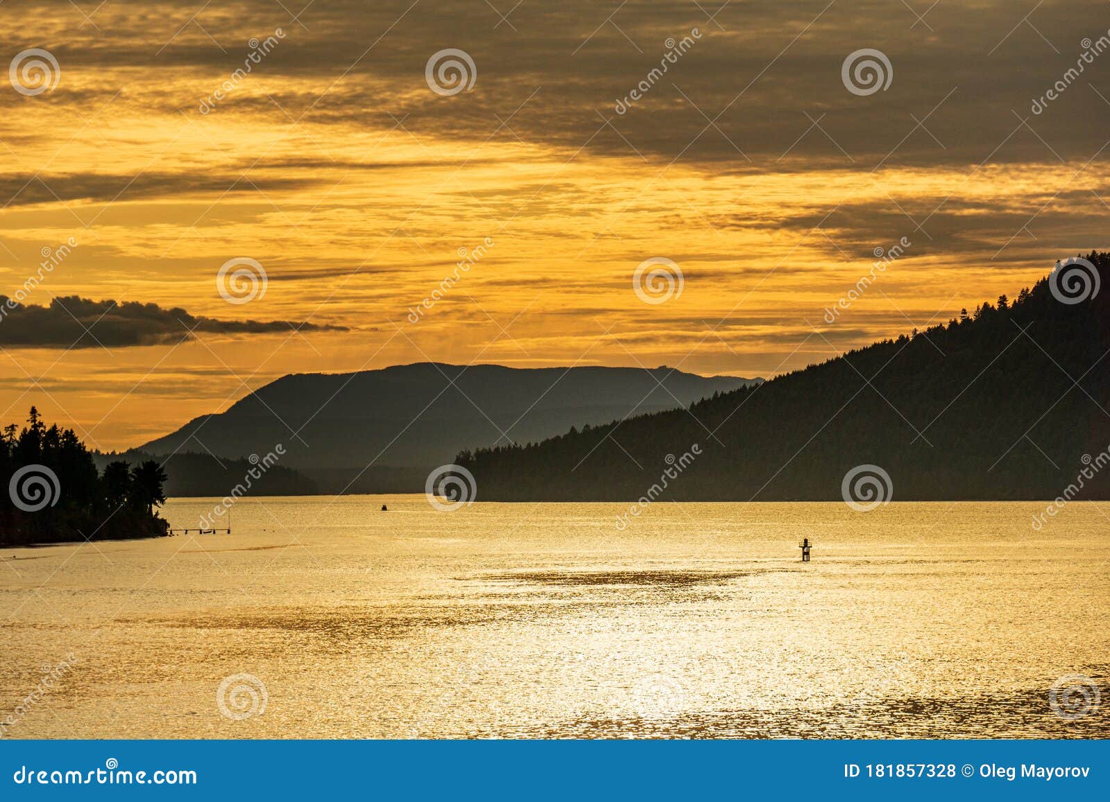 Beautiful Sunset Ocean Bay with Orange Sky Mountains and Clouds Stock ...