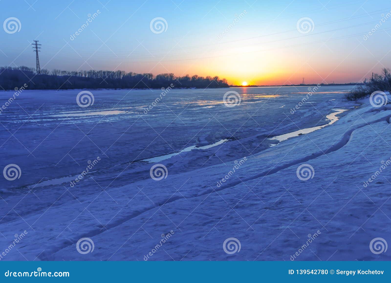 Beautiful Sunset Over a Frozen River. the River is Bound by Ice. Spring ...