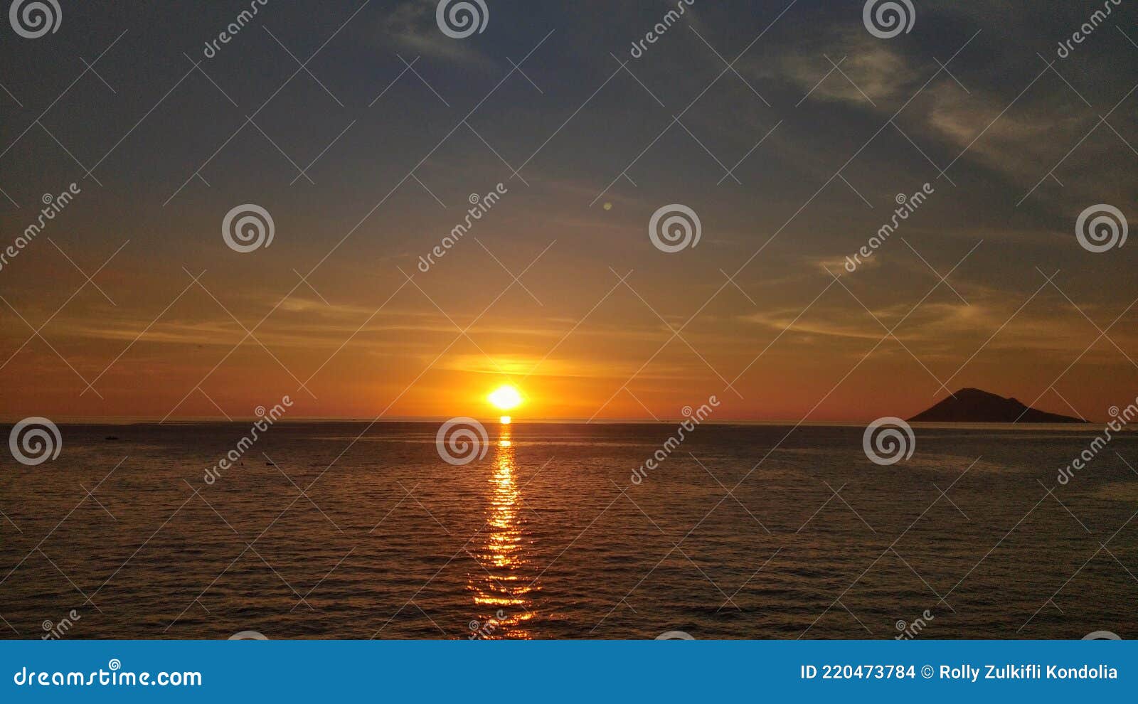 Beautiful Sunset Over the Ocean and an Island Stock Photo - Image of ...