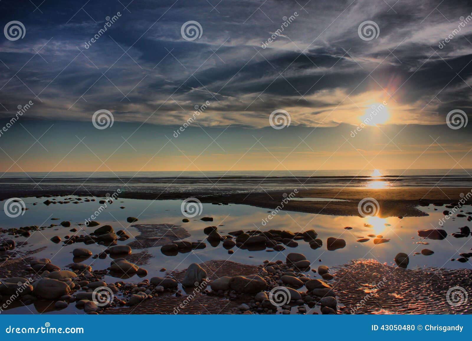 A Beautiful Sunset Over a Quiet Calm Ocean Stock Photo - Image of ...