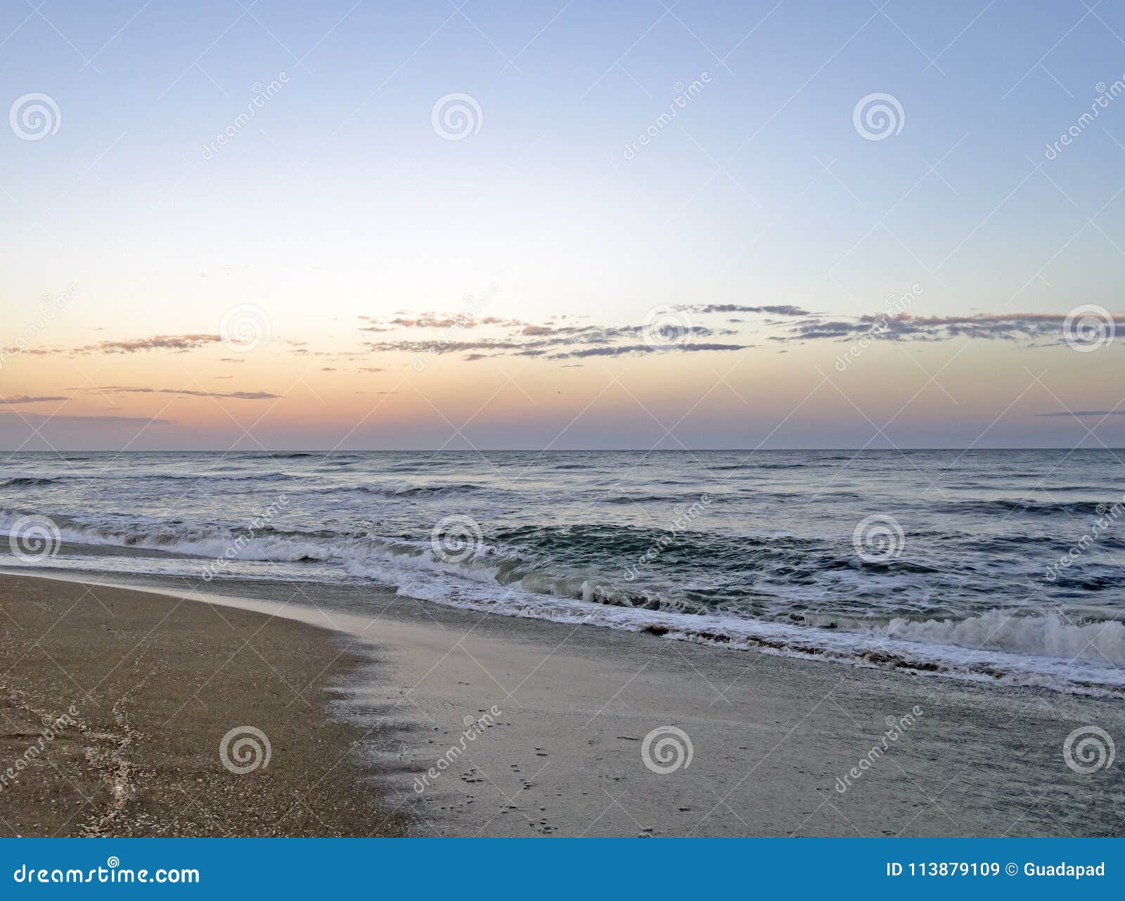 Beautiful Sunset on a Peaceful Isolated Beach Stock Image - Image of ...