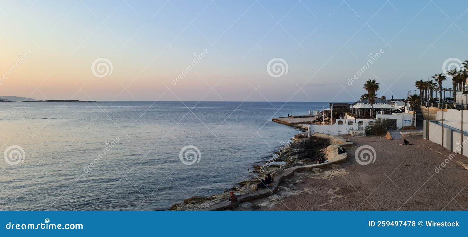 Beautiful Sunset Reflecting on the Surface of the Sea in Front of the ...