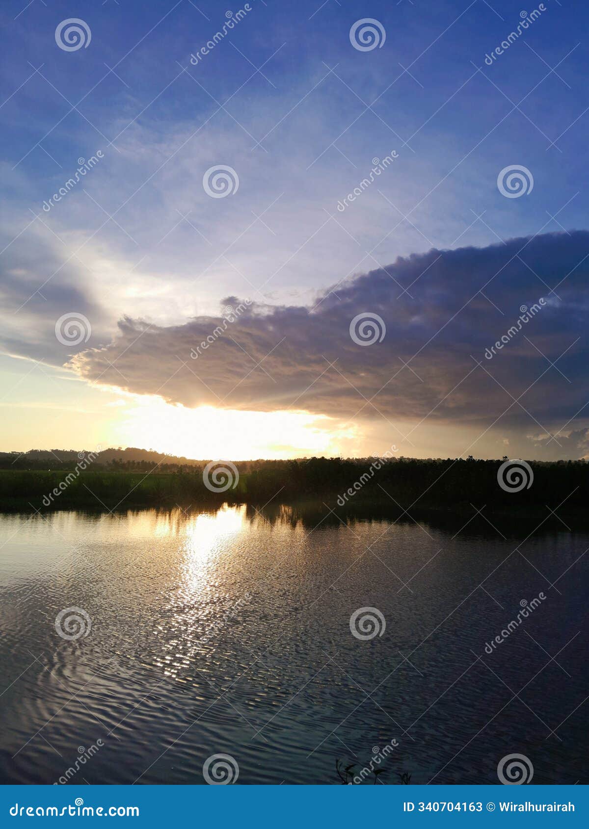 Beautiful Sunset Reflection Over Still Water with Colorful Sky and ...