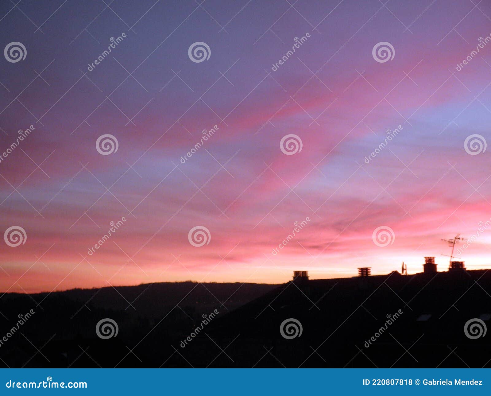 Sunset and rooftops stock photo. Image of colors, horizon - 220807818