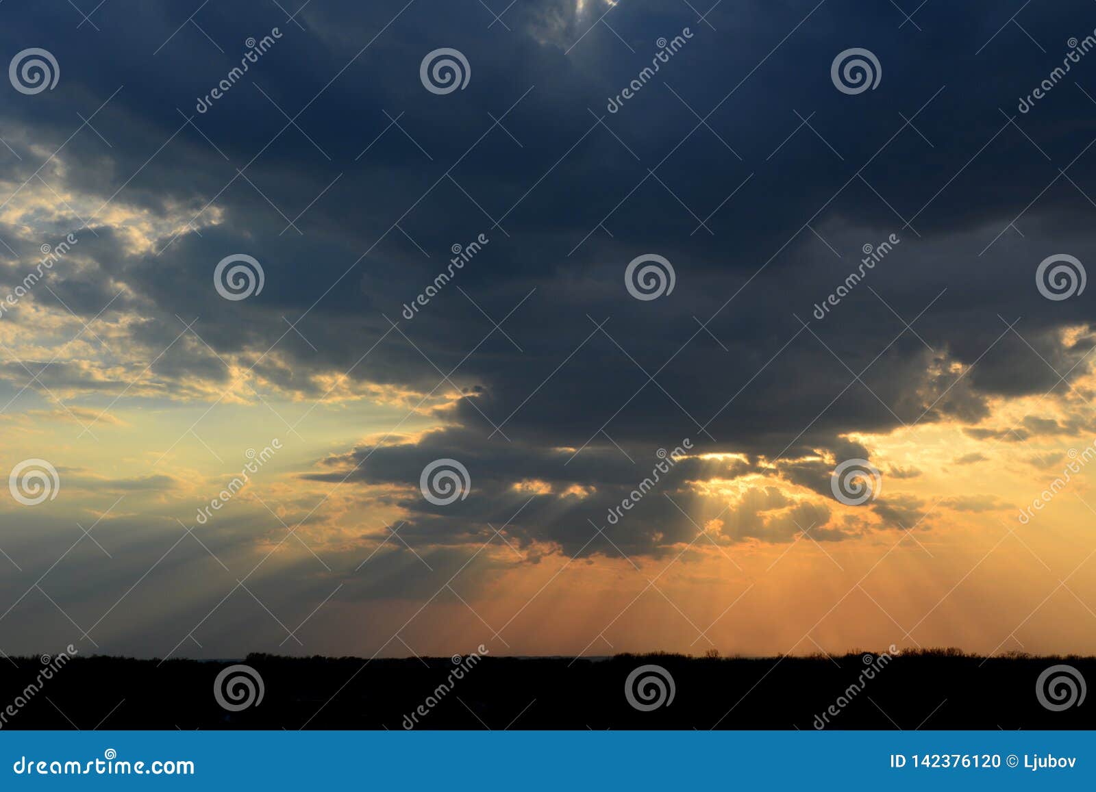 Beautiful Sunset Sky with Dramatic Light. Sun Rays through Dark Clouds ...