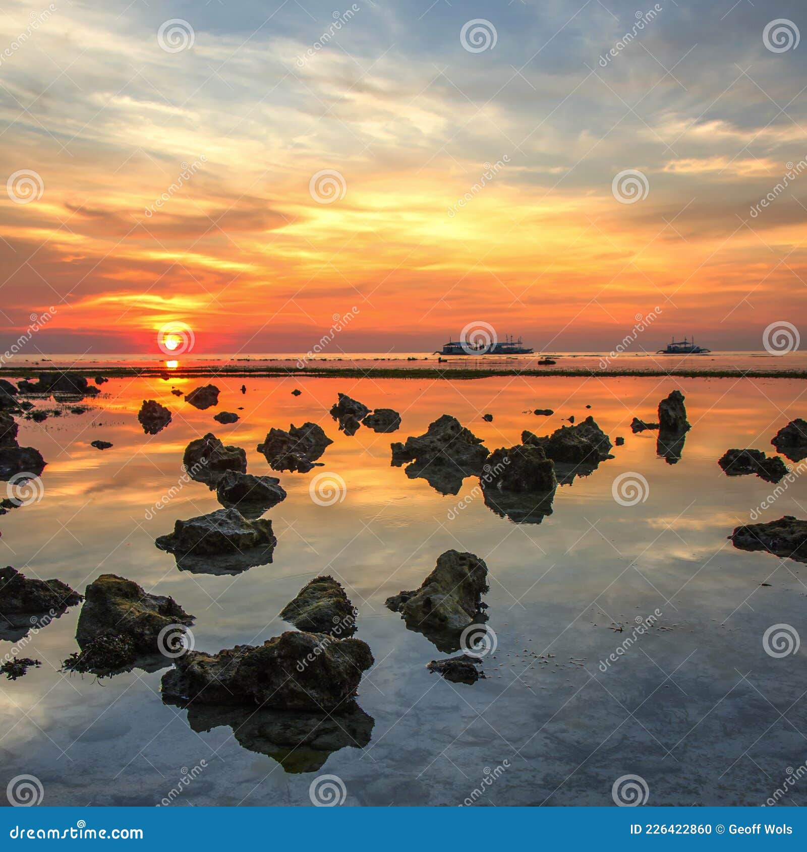 Beautiful Sunset on the Water with Rocks on Malapascua Island in the ...