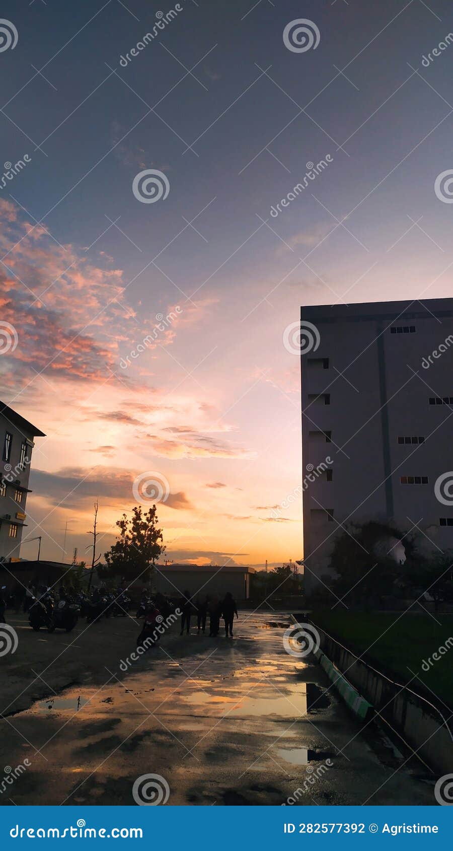 Beautiful Sunset with Wet Buildings and Streets Stock Photo - Image of ...
