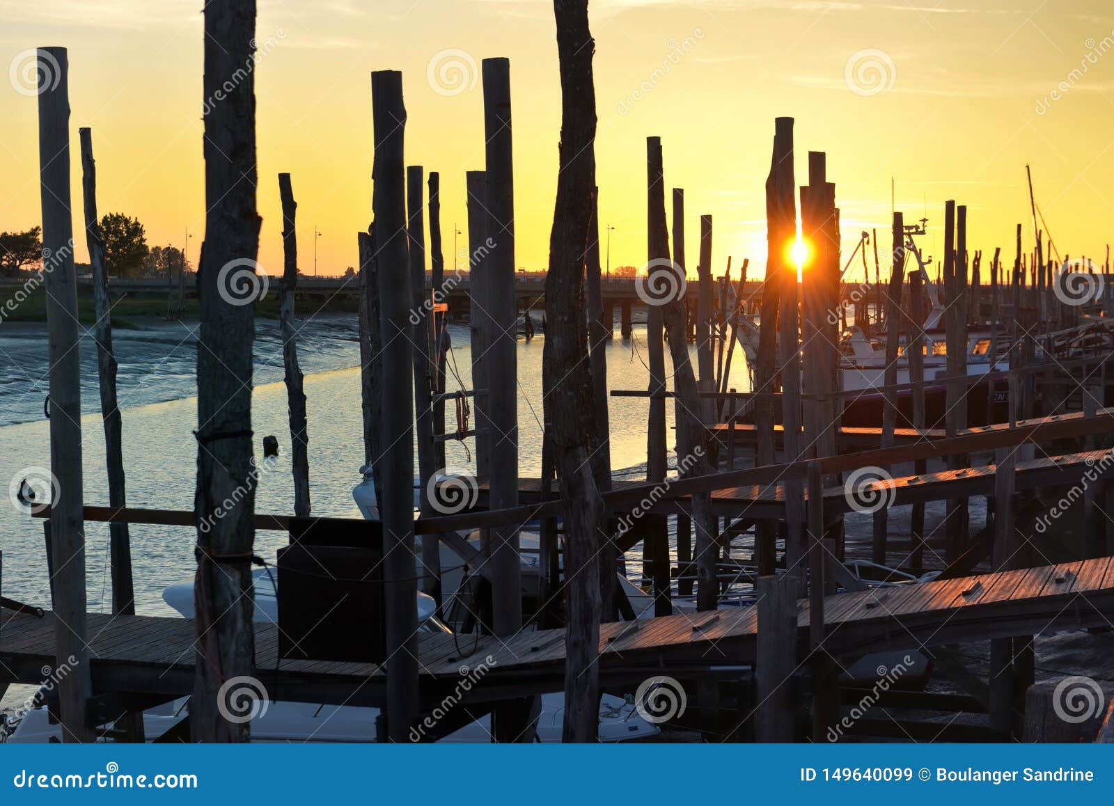 Sunset on a Wooden Posts of an am Port Stock Image - Image of sunset ...