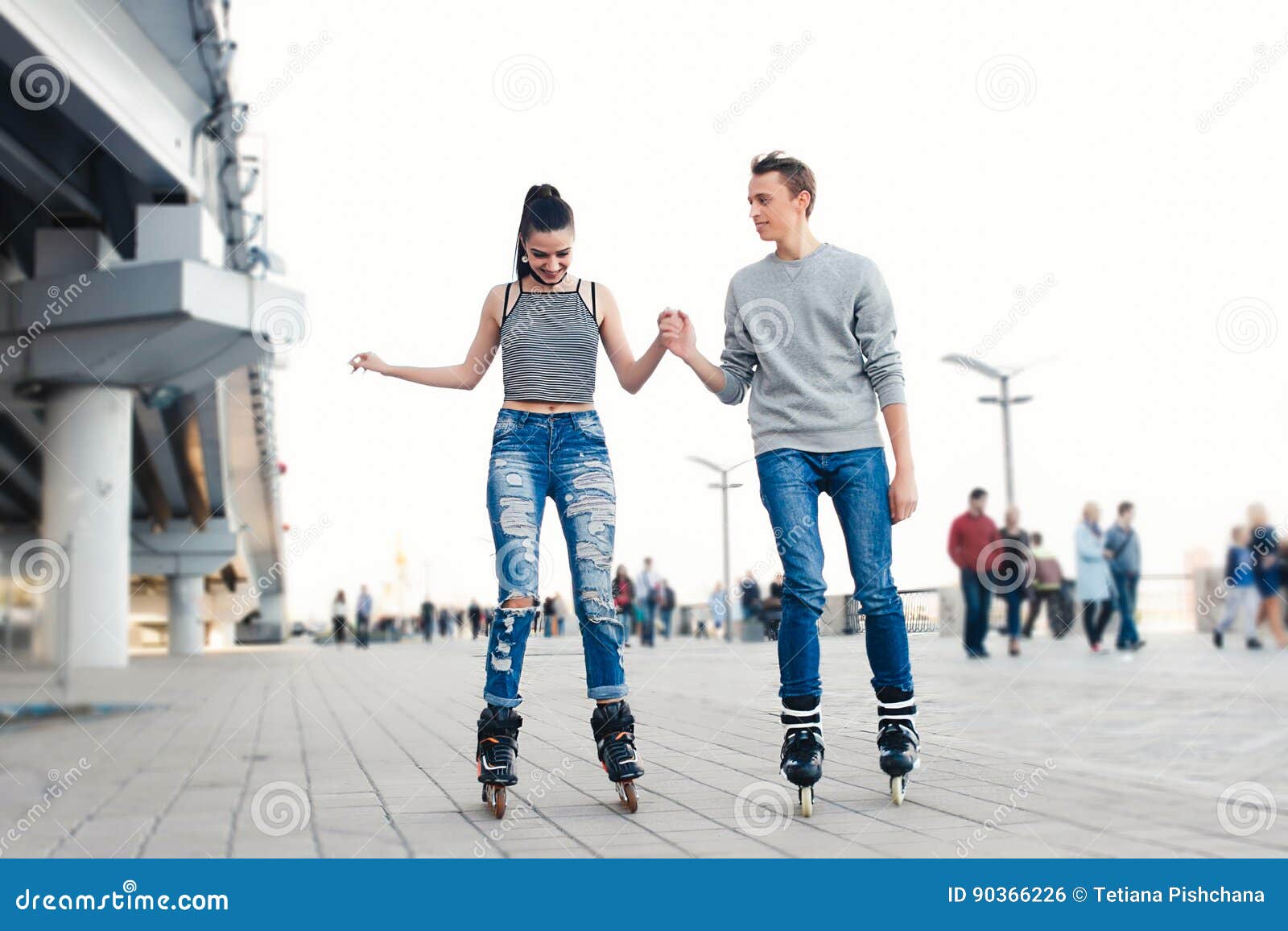 Beautiful Sweet Couple Riding on Roller Skates Stock Photo - Image of ...