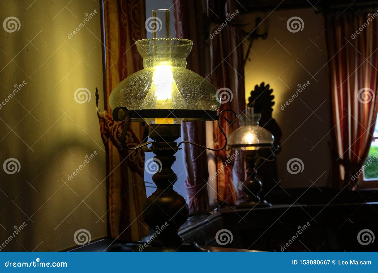 A Beautiful Table Lamp Stands in a Room Stock Image - Image of brass ...