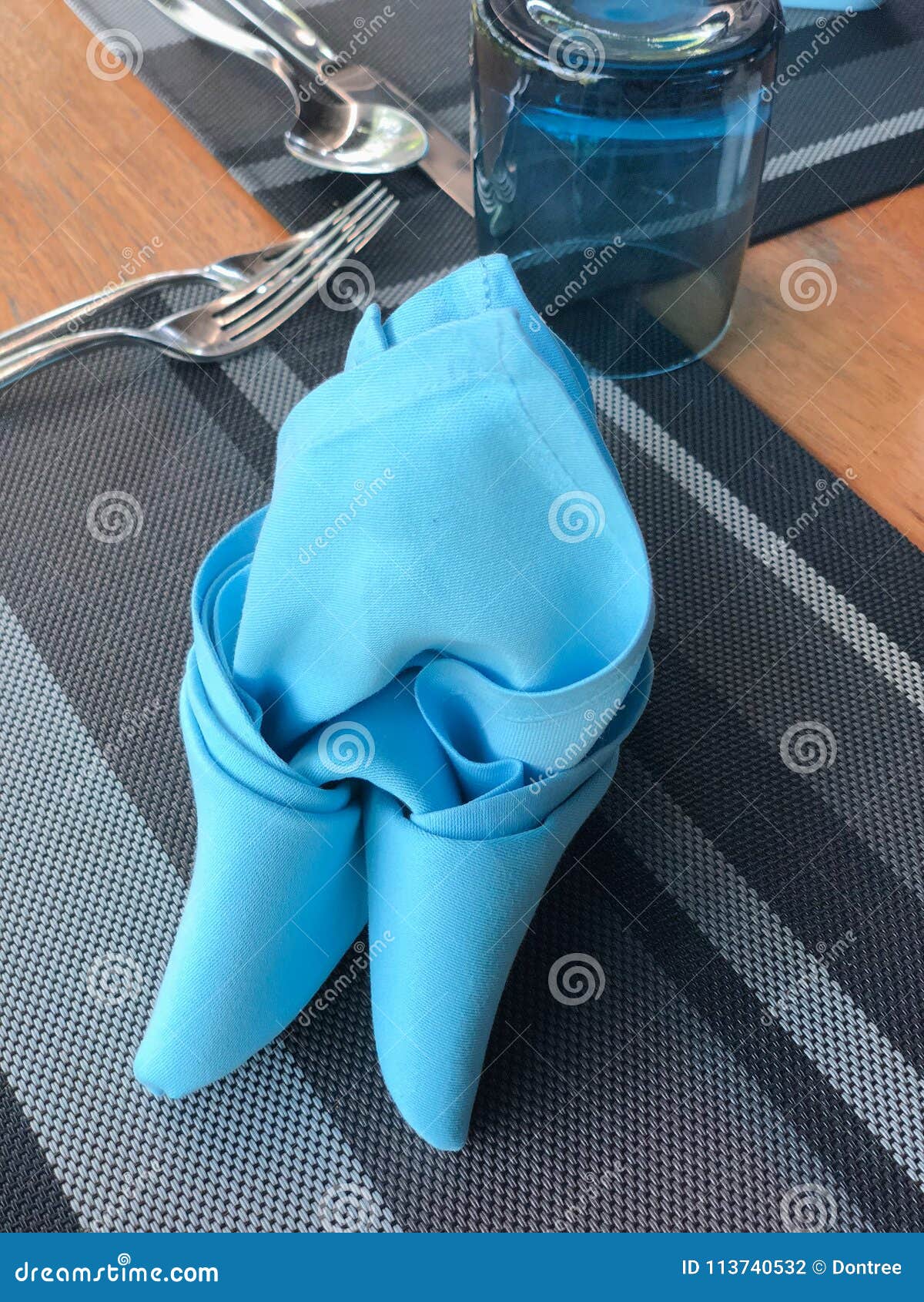 Beautiful Table Setting with Blue Napkin Stock Photo - Image of closeup ...