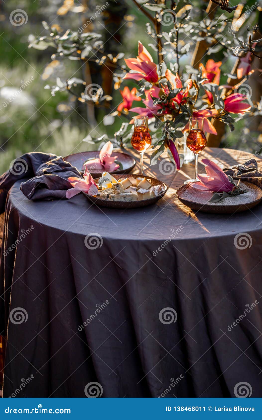 Beautiful Table Setting in Garden on Sunset Light. Table Decorated with ...
