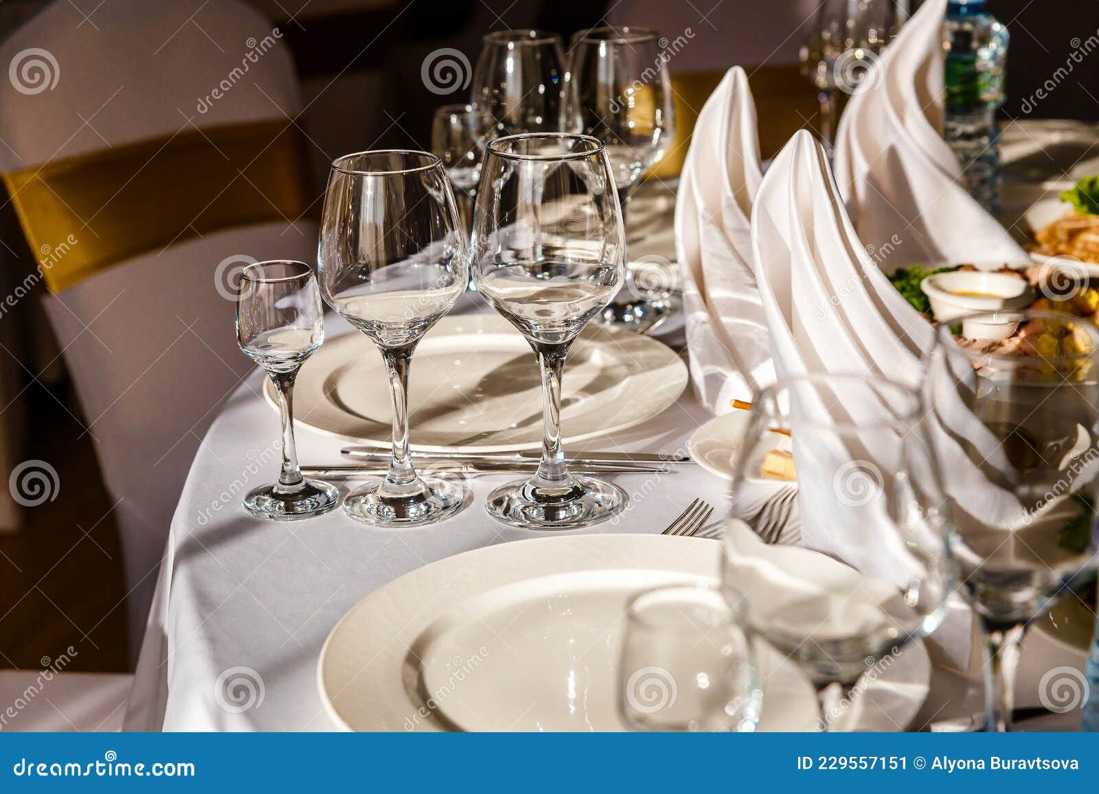 Beautiful Table Setting. Glasses, Plates on Round Table in Sunlight ...
