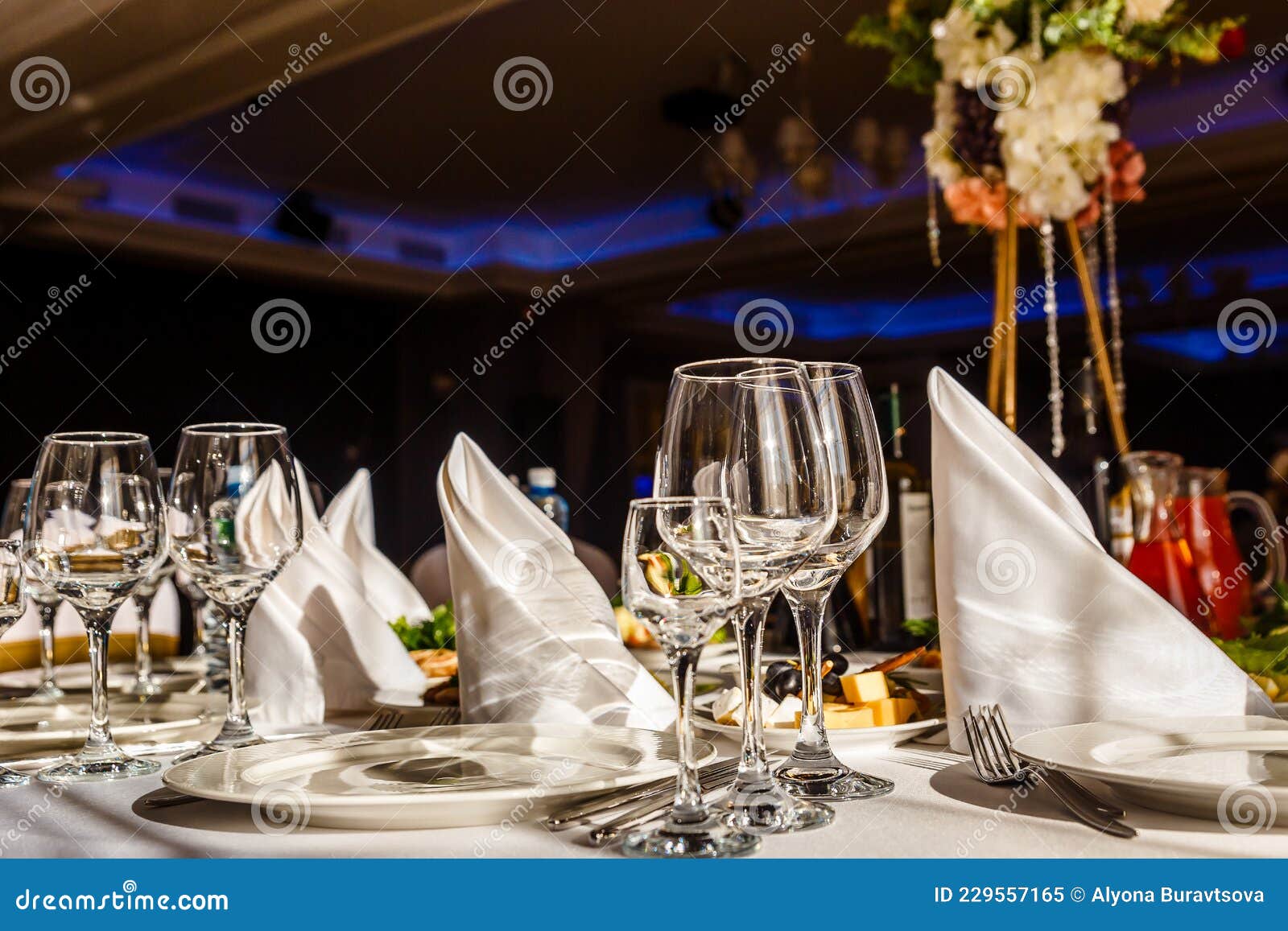 Beautiful Table Setting. Glasses, Plates on Round Table in Sunlight ...