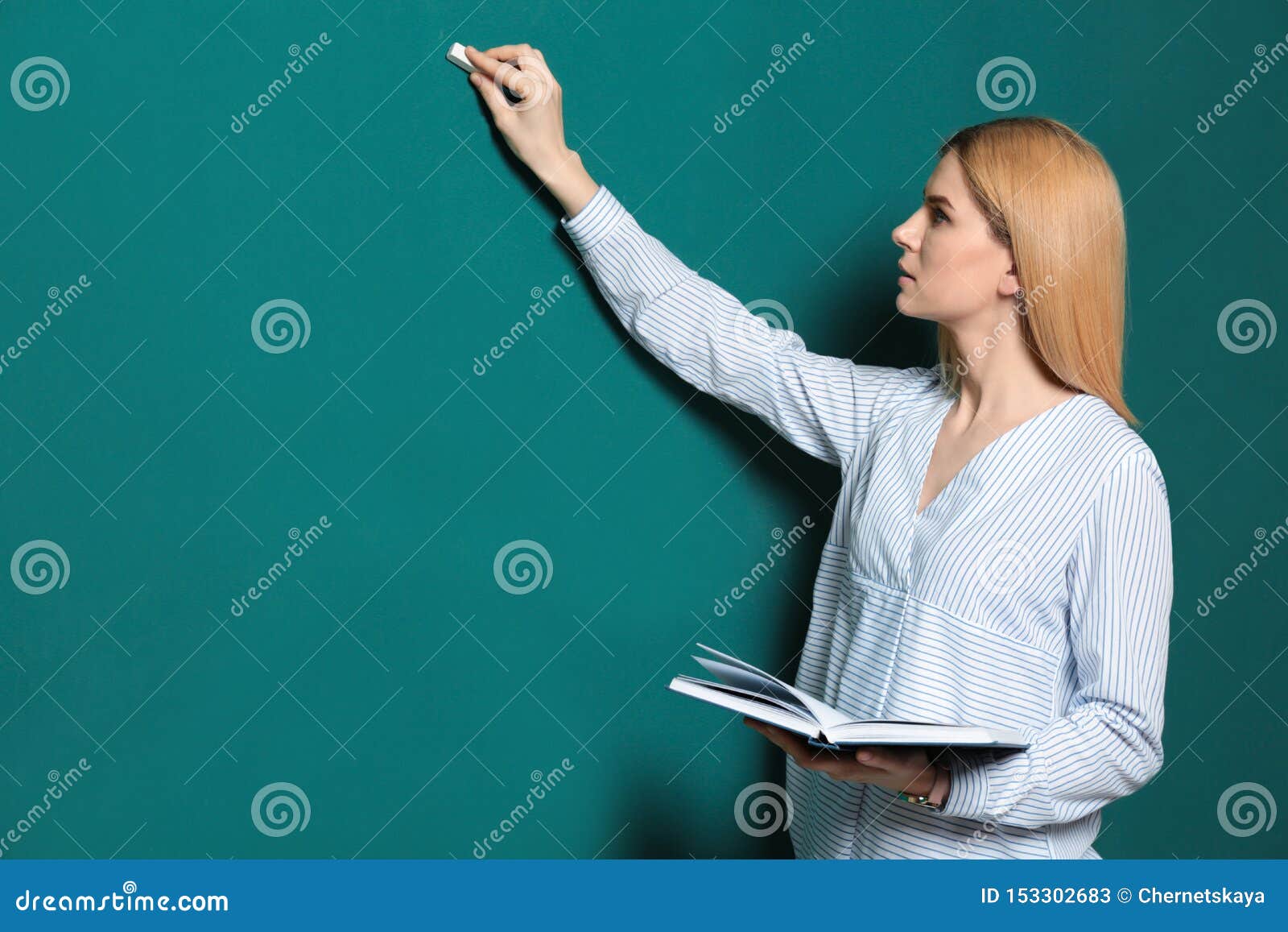 Beautiful Teacher with Book Writing on Chalkboard Stock Image - Image ...
