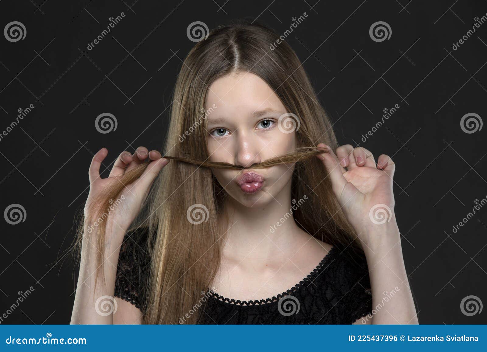 Beautiful Teenage Girl Fooling Around In Front Of The Camera Stock