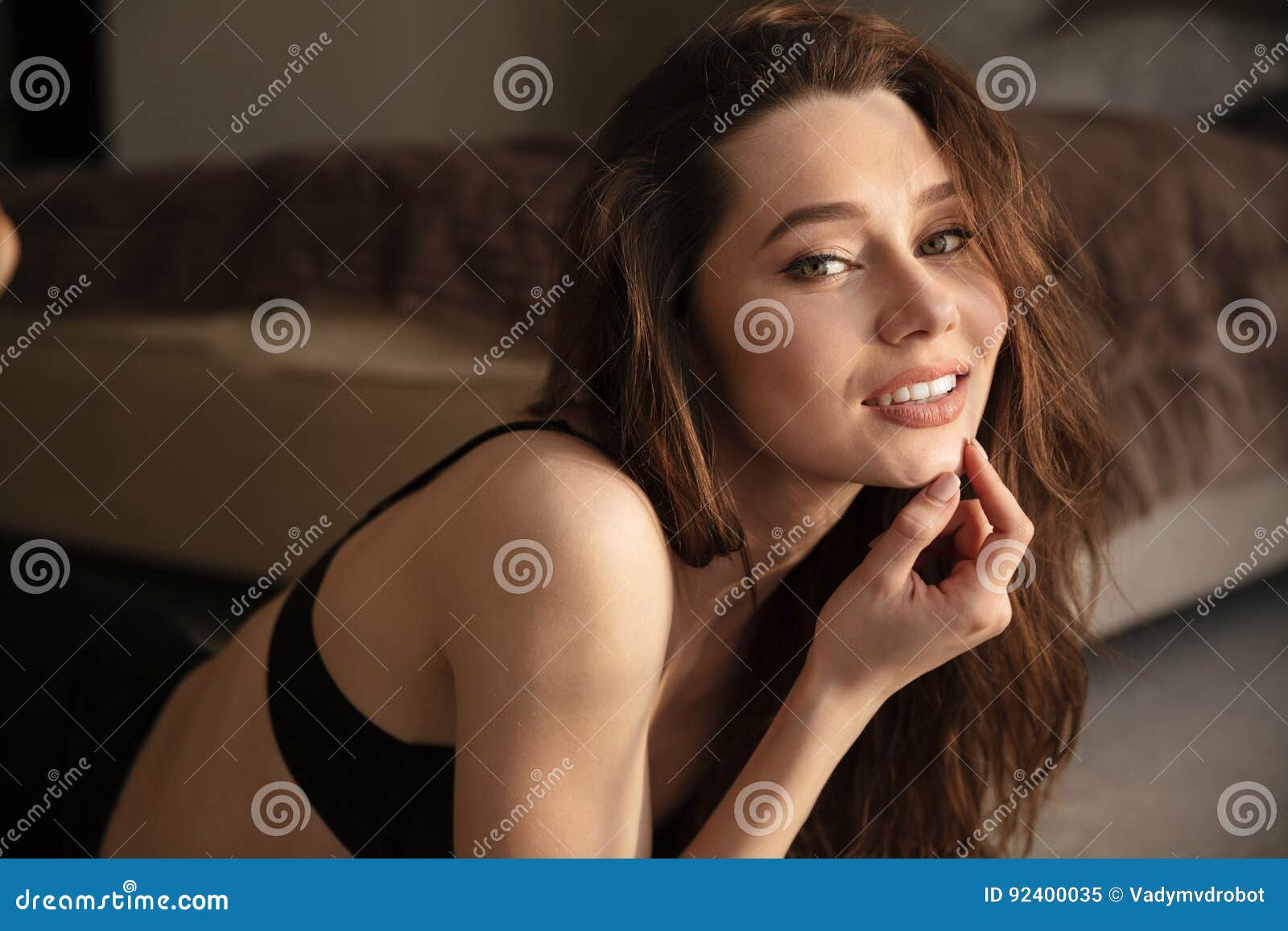 Beautiful Tempting Young Woman In Lingerie Relaxing In Bedroom Stock