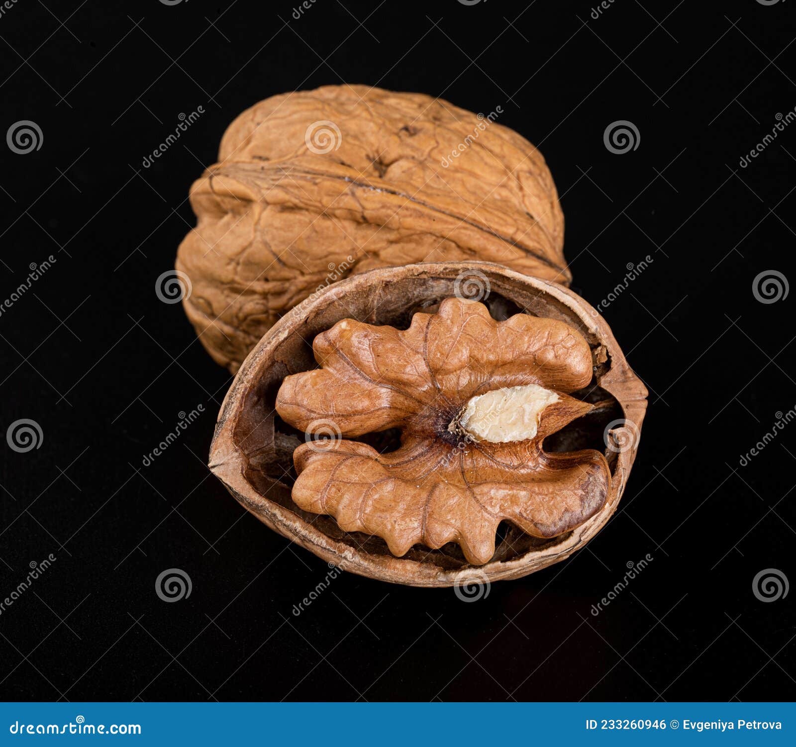 A Beautiful Textured Walnut in a Shell and a Split Walnut with Half a ...