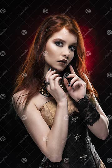 A Beautiful Thoughtful Redhead Cosplay Girl Wearing A Victorian Style