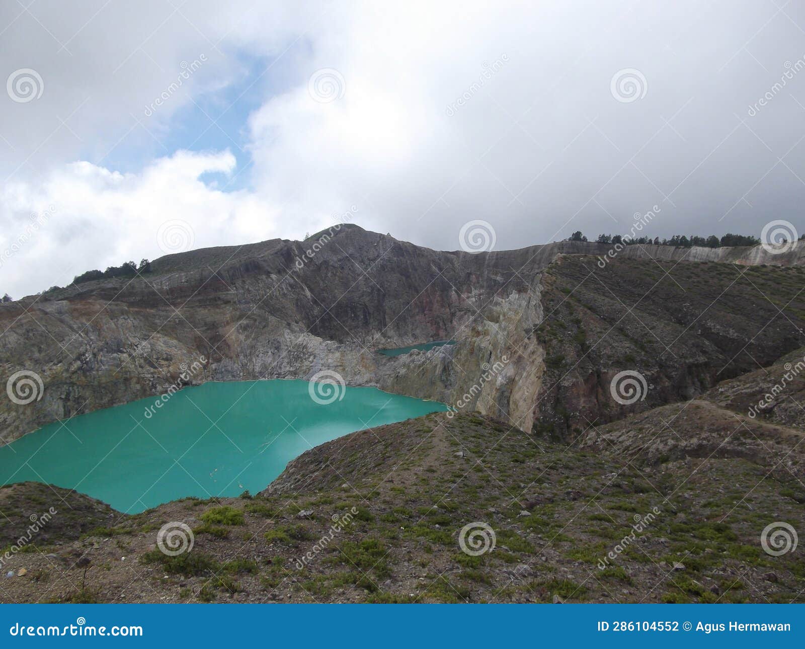 The Beautiful Three-colored Lakes on Mount Kelimutu Stock Photo - Image ...