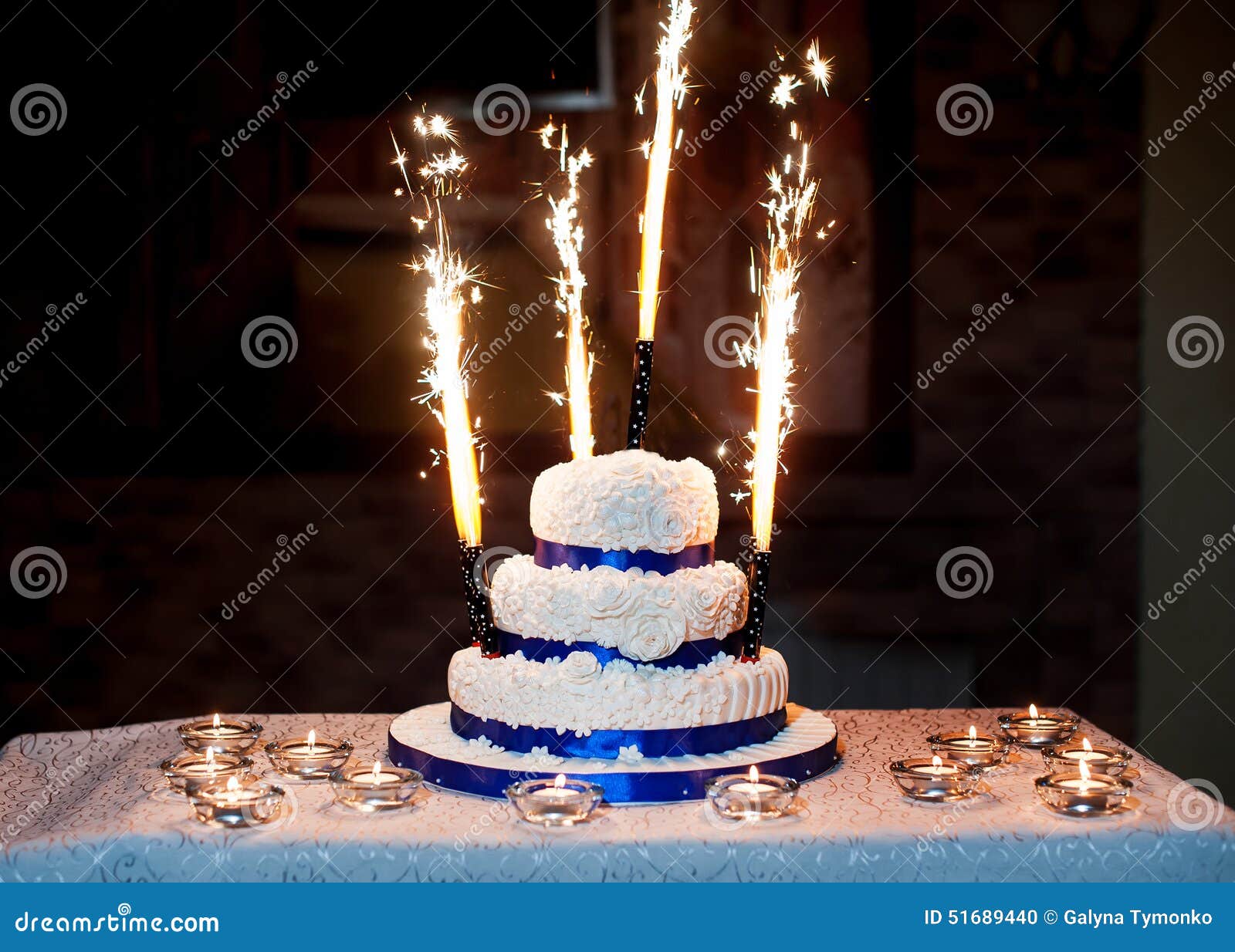 Beautiful Three-layered Wedding Cake with Fireworks Stock Photo - Image ...