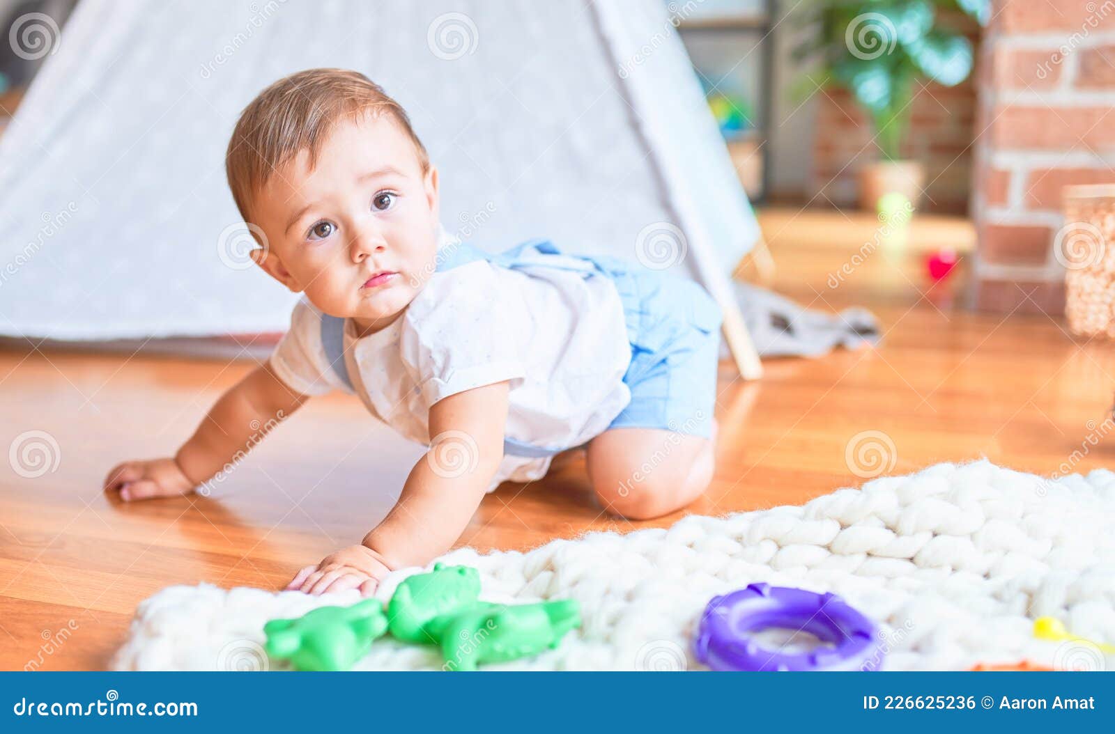 Beautiful Toddler Crawling at Kindergarten Stock Photo - Image of ...