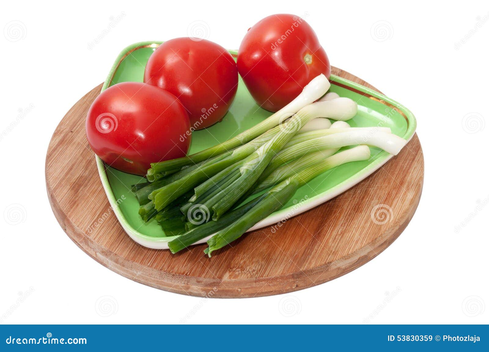 Beautiful Tomato and Young Onions on the Green Triangle Plate Stock ...