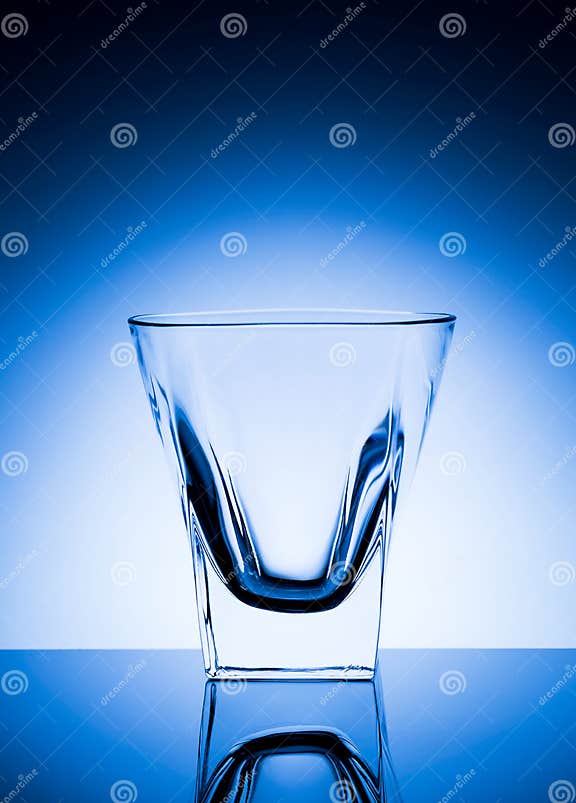 Beautiful Transparent Glass on a Blue Background Stock Photo - Image of ...