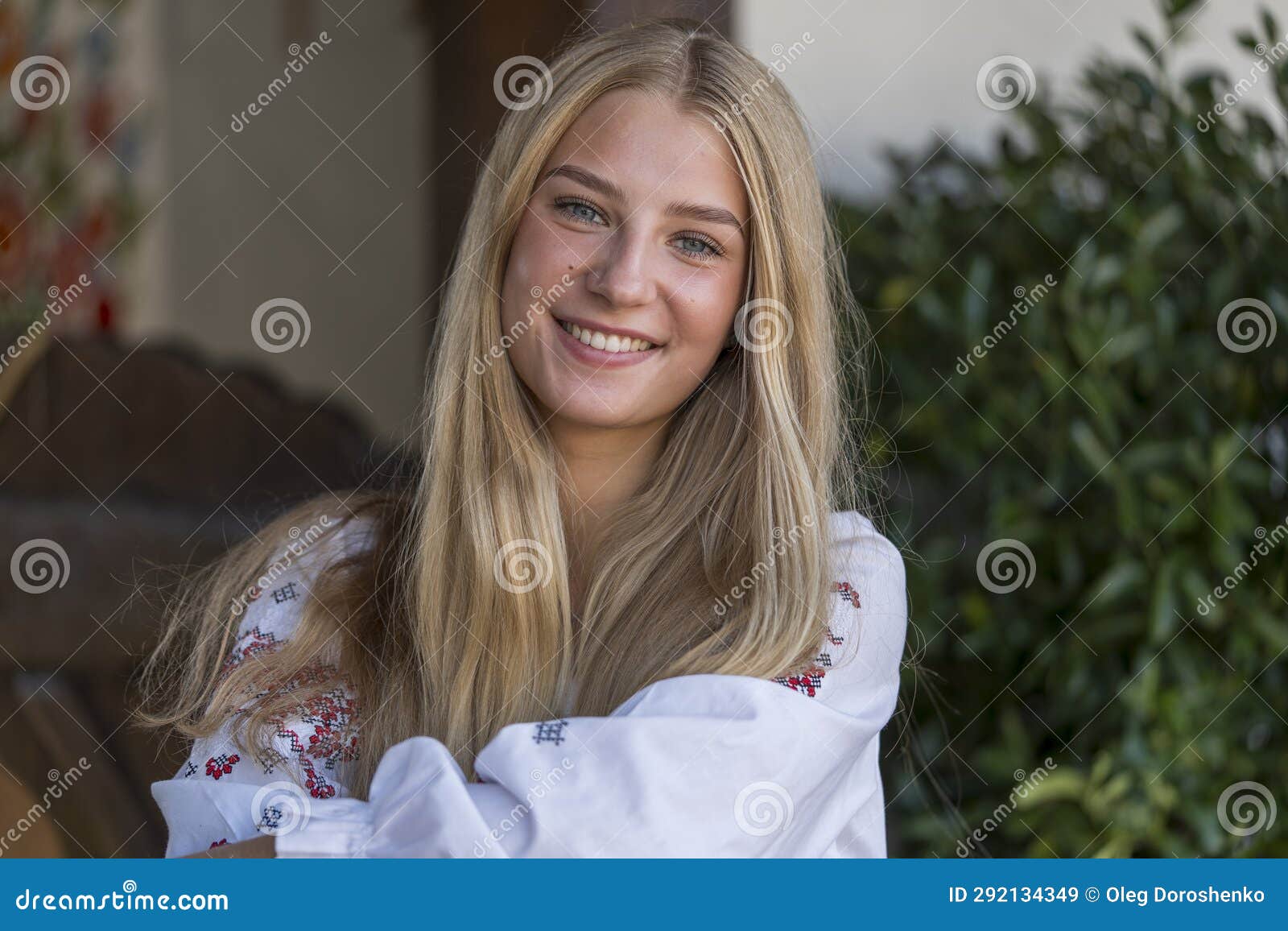 Beautiful Ukrainian Girl With Long Blond Hair And Blue Eyes In Embroidered Dress Invites