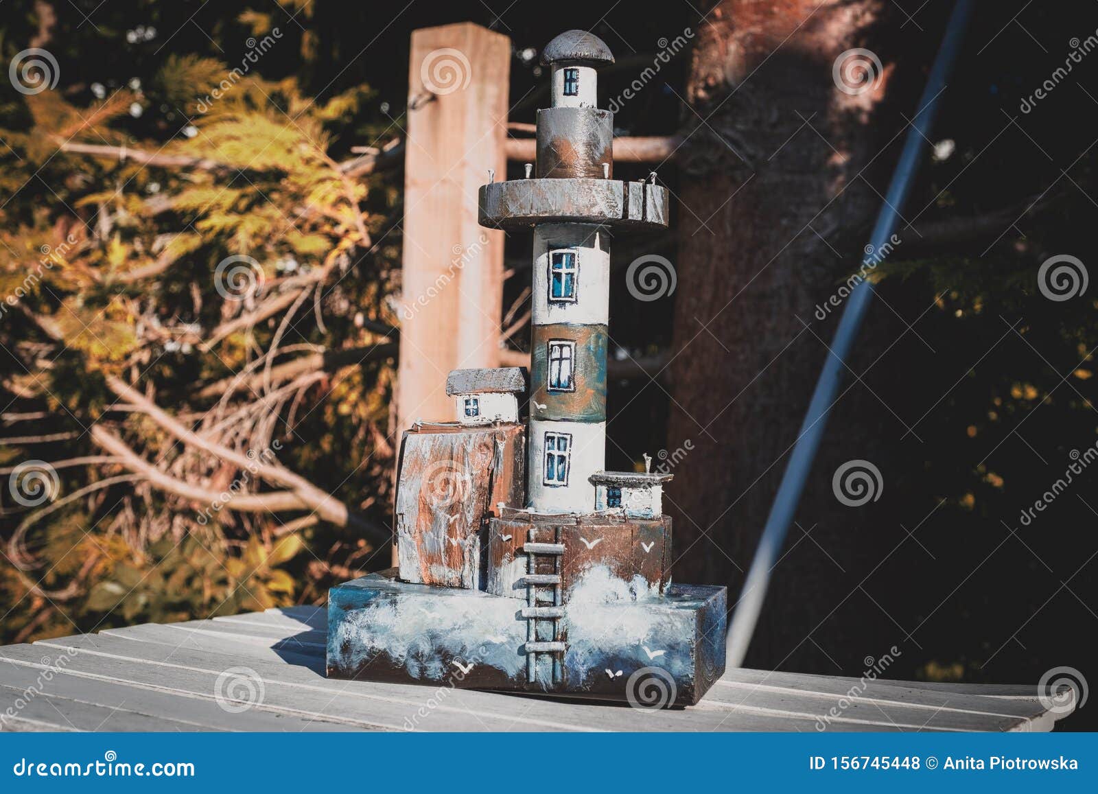 A Handcrafted Wooden Lighthouse Stock Photo - Image of matched ...