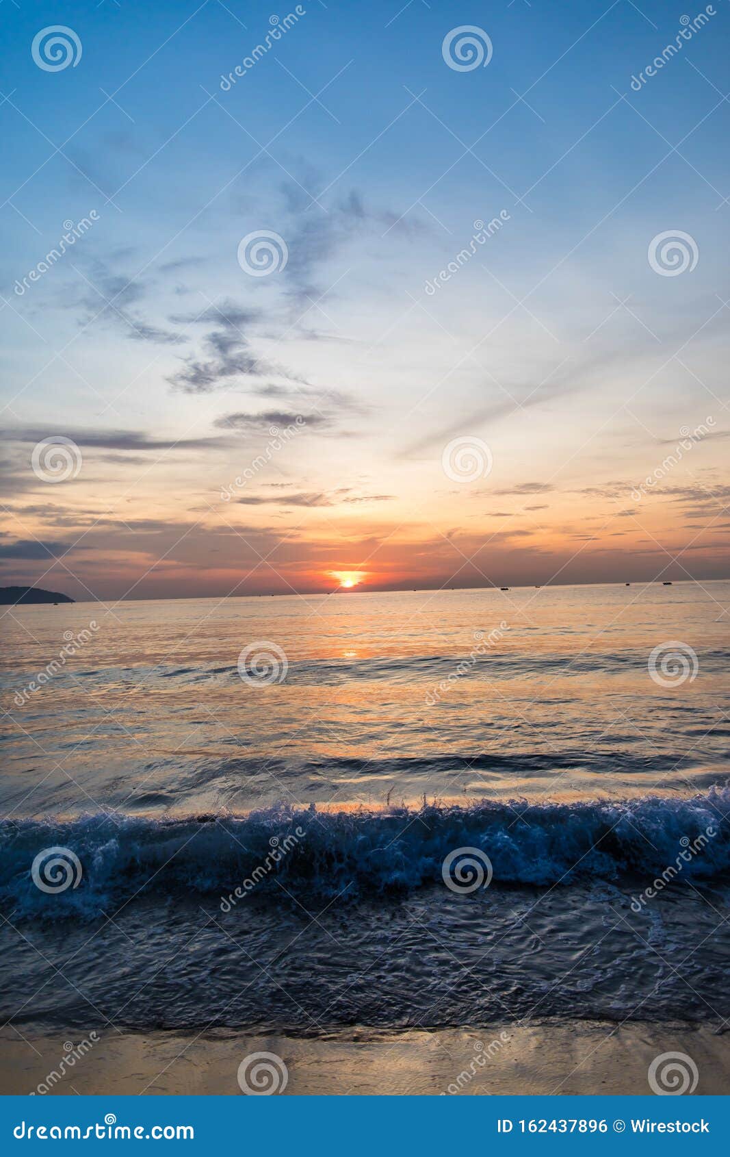 Beautiful Vertical Shot of the Sunset Reflected in the Sea Creating a ...