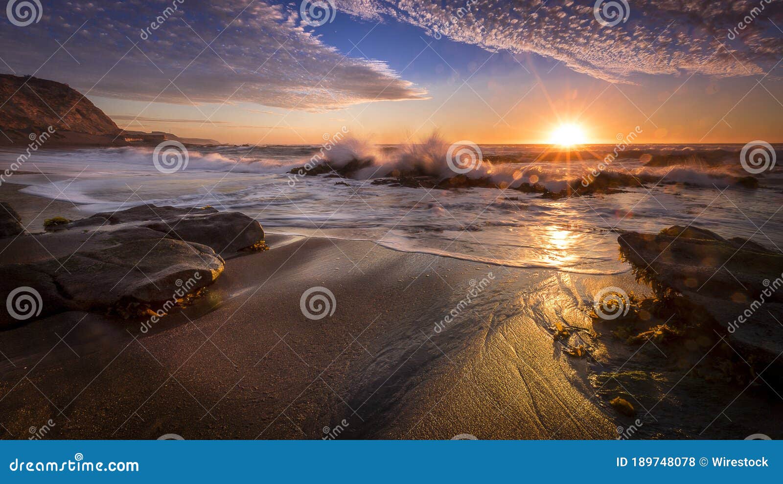 Beautiful View of a Beach with Times during the Sunset Stock Photo ...