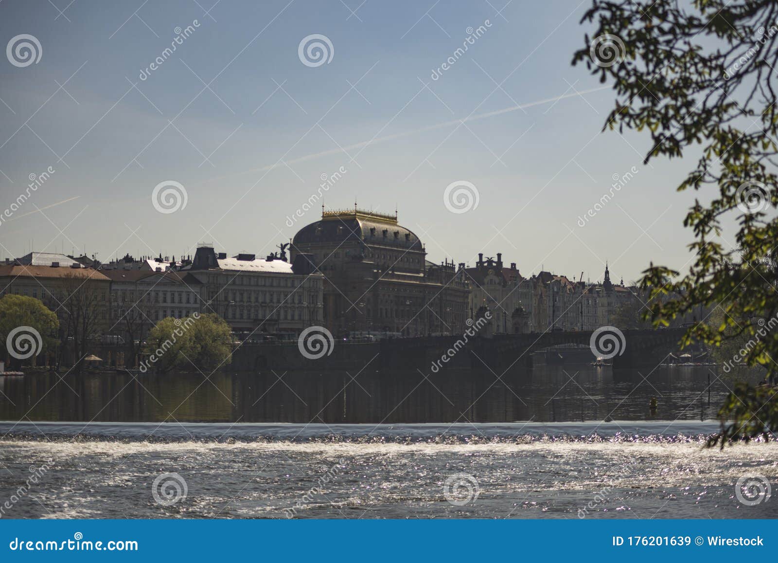 Beautiful View of Buildings Near the River with a Bridge and a ...