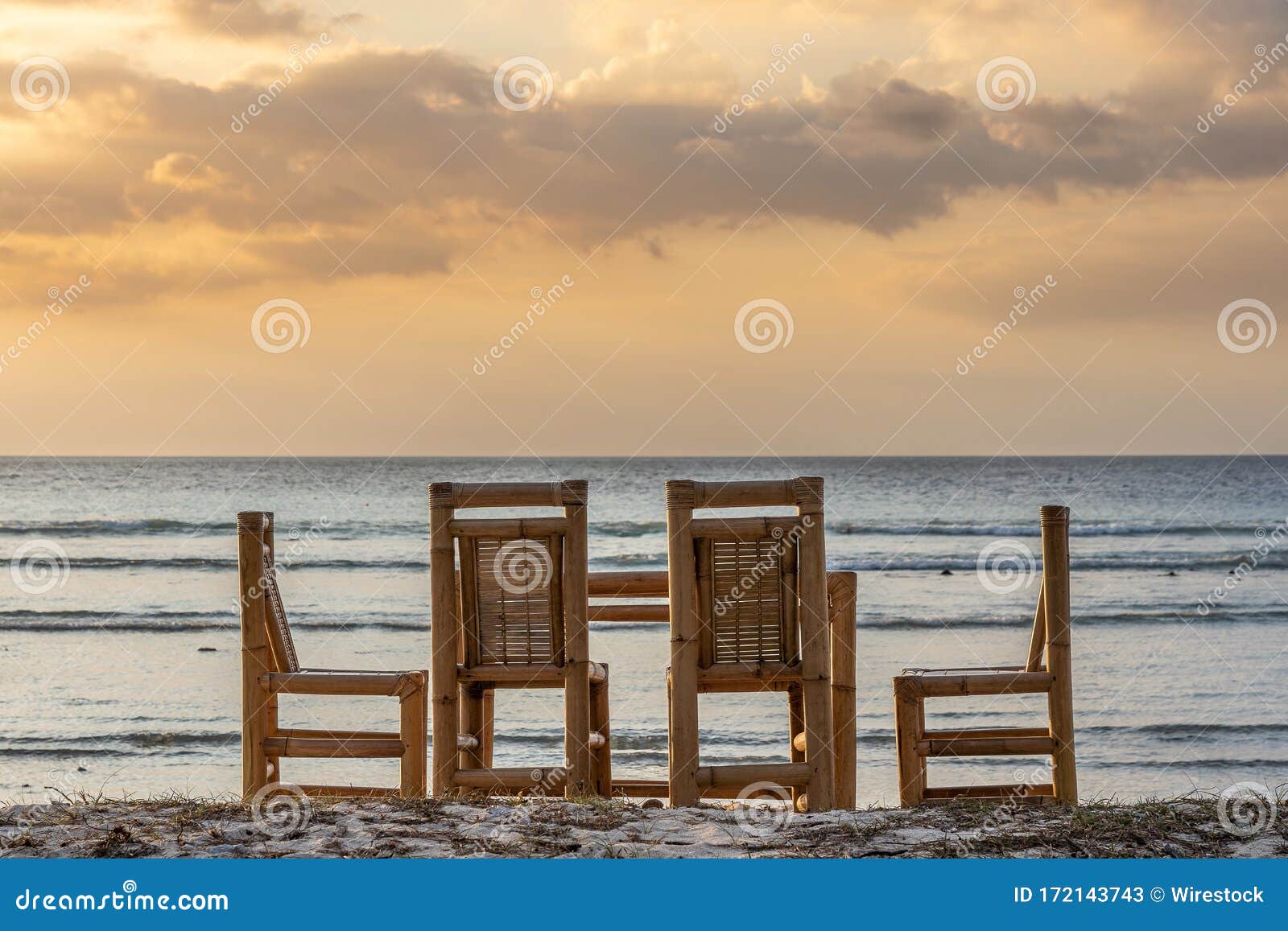 Beautiful View of a Dining Table on the Beach with a Scenery of Sunset ...