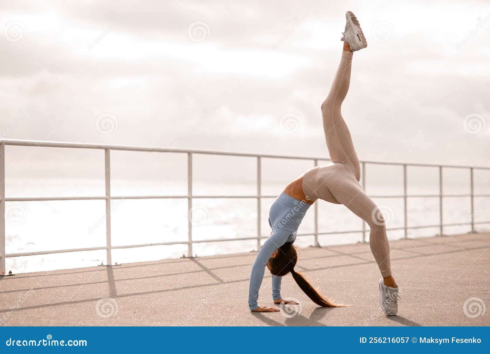 Beautiful View Of Flexible Woman With Raised Leg Stretching For Training Body Flexibility Stock