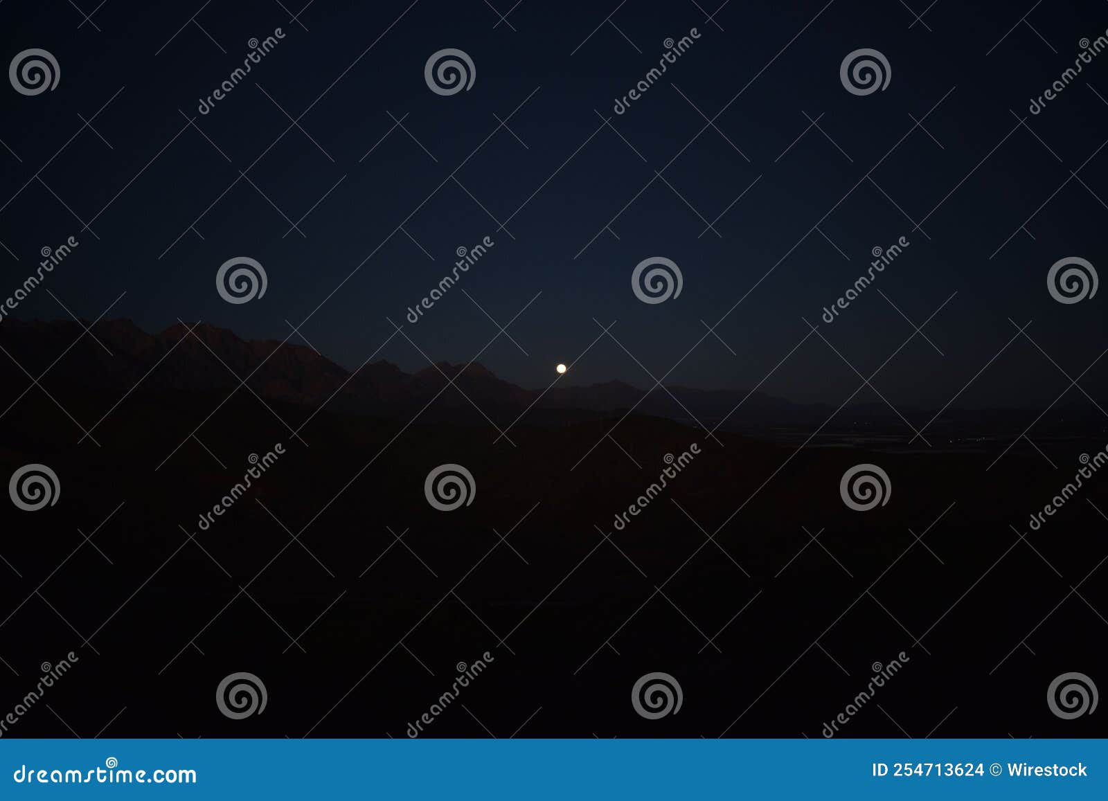 Beautiful View of the Moon with Hills in the Foreground Stock Photo ...