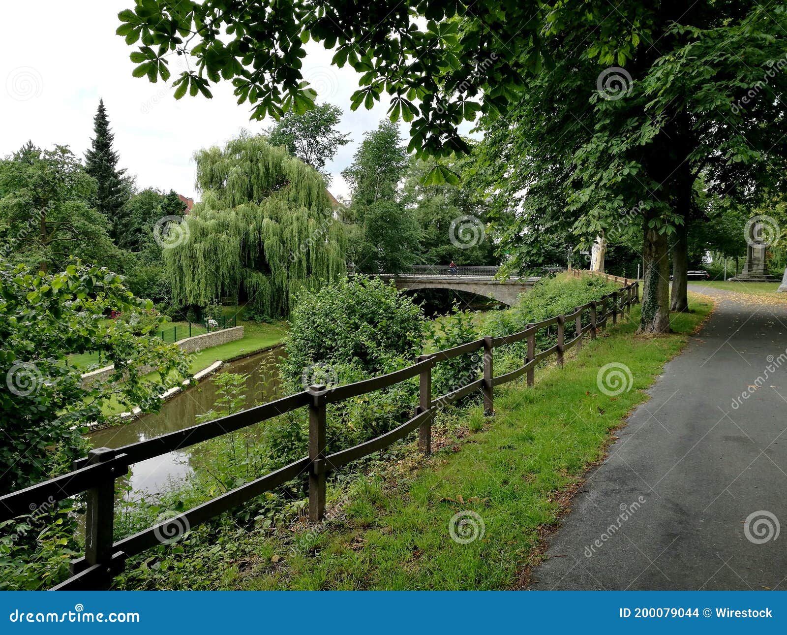 Beautiful View of a Park with a Bridge Over a River Stock Photo - Image ...