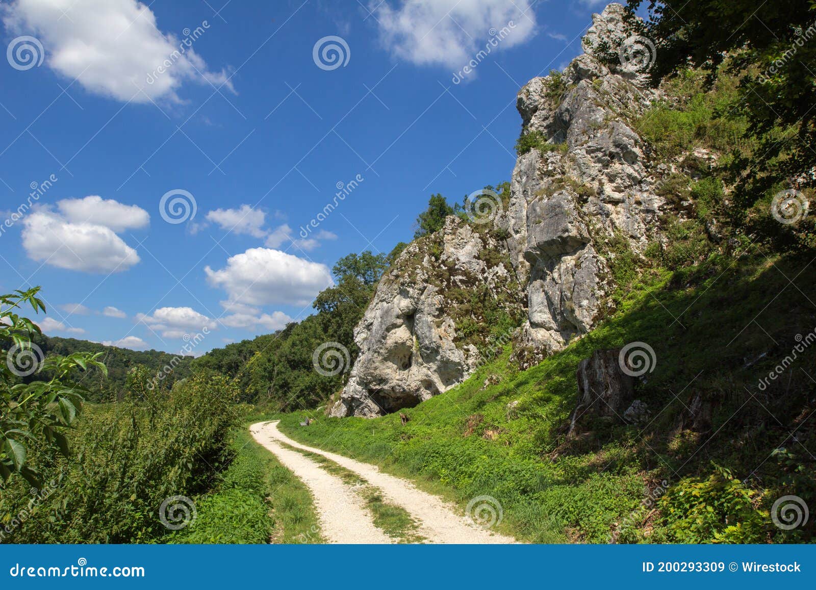 Beautiful View of a Path Surrounded by Rock Formations and Greenery ...