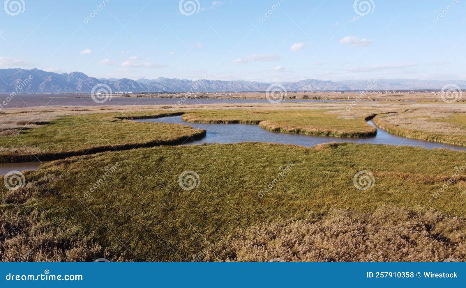Beautiful View of Prairie Fields with Blue Lake Under Blue Sky with ...
