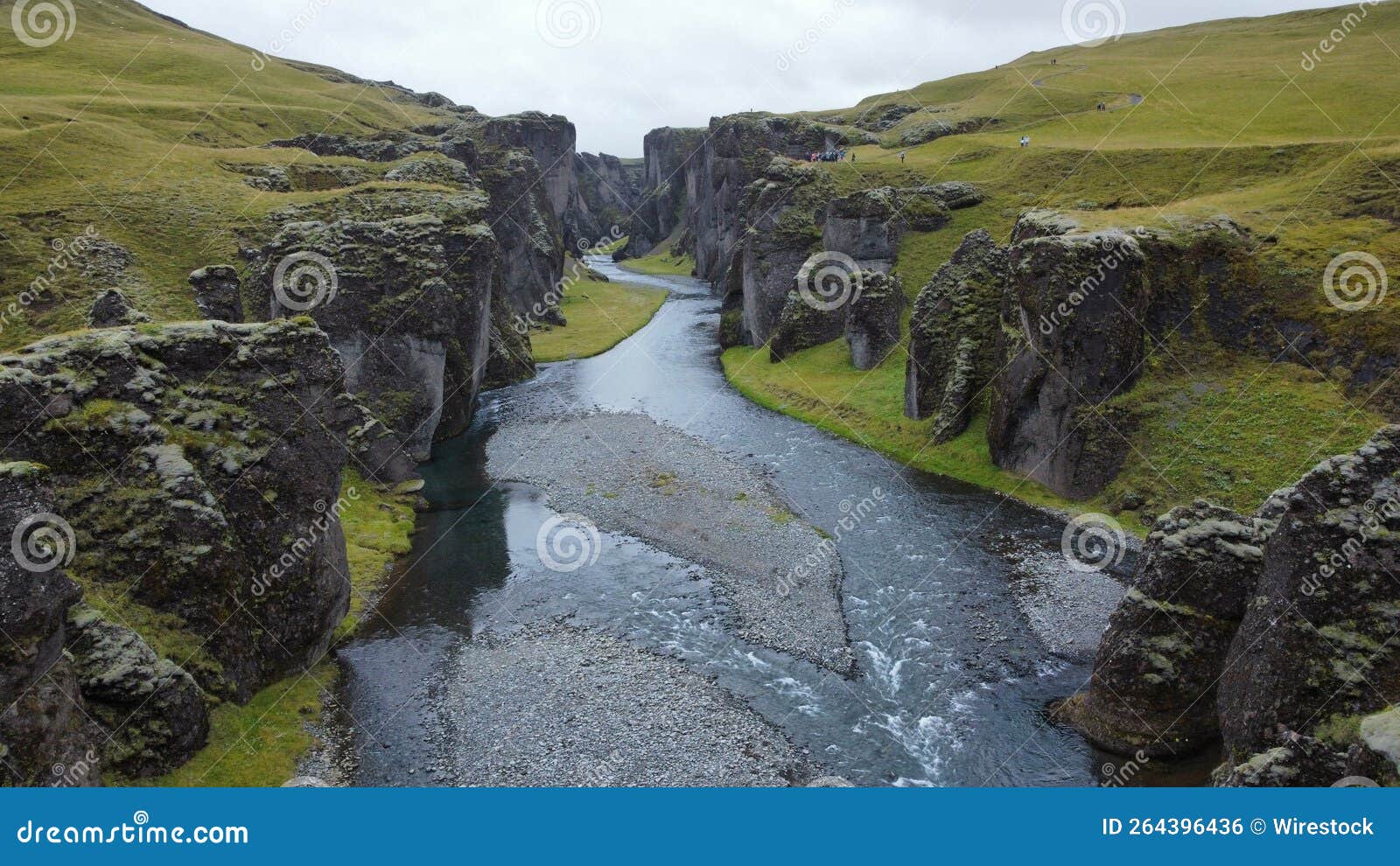 Beautiful View of a River and Cliffs with Greenery Under the Cloudy Sky ...
