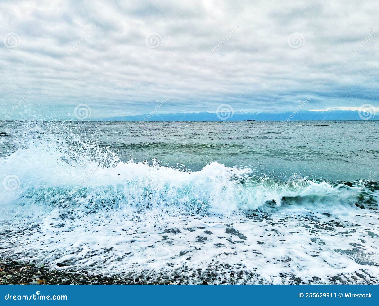 Beautiful View of a Rocky Beach with Waves during a Cloudy Day Stock ...