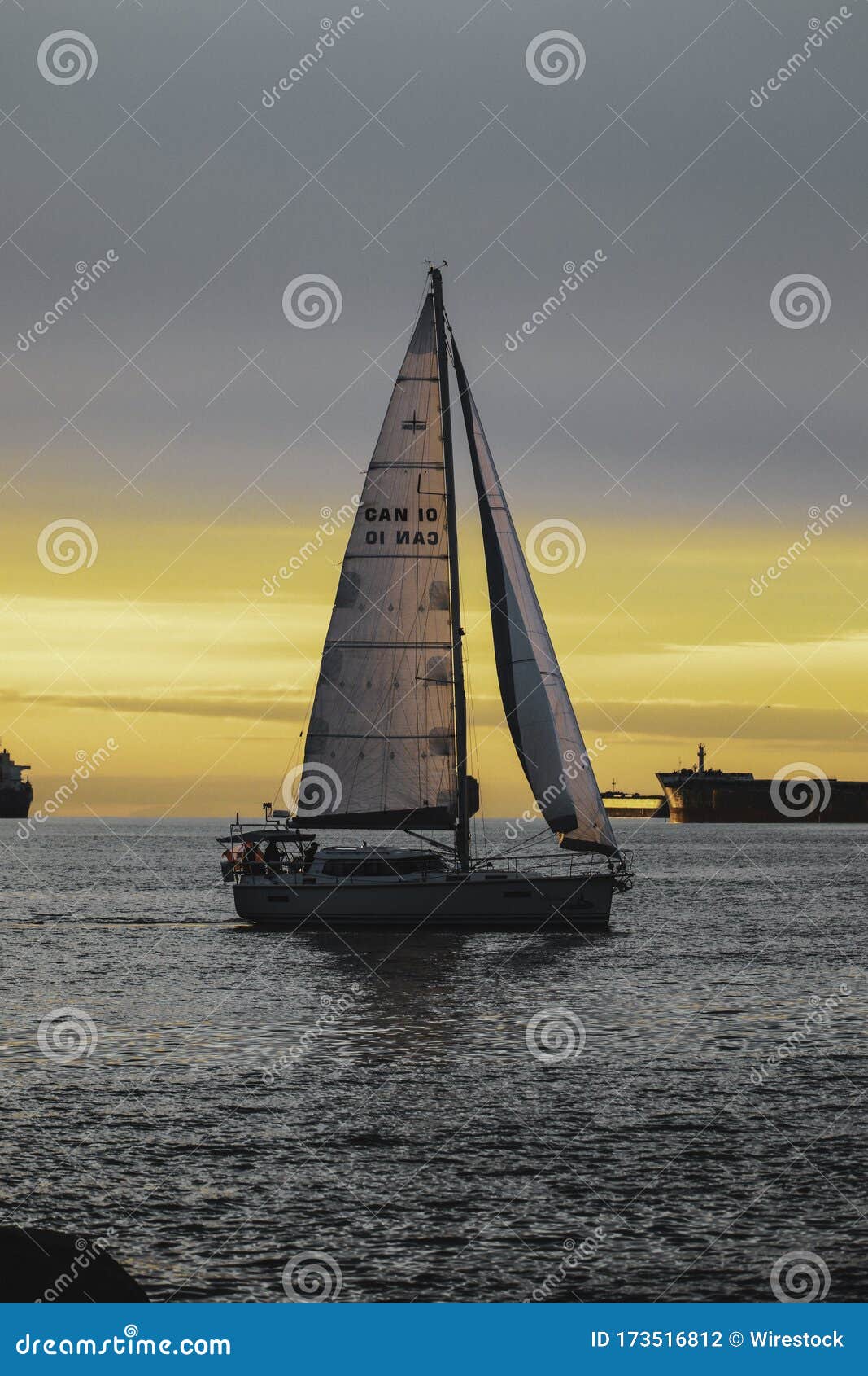 Beautiful View of a Sailing Boat in the Lake during Sunset with a Ship ...