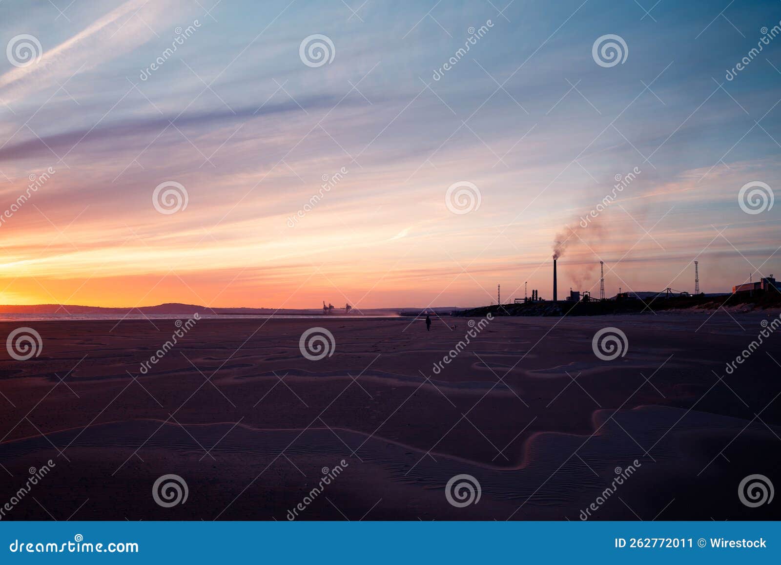 Beautiful View of a Sandy Beach with Steel Works Pollution at Sunset ...