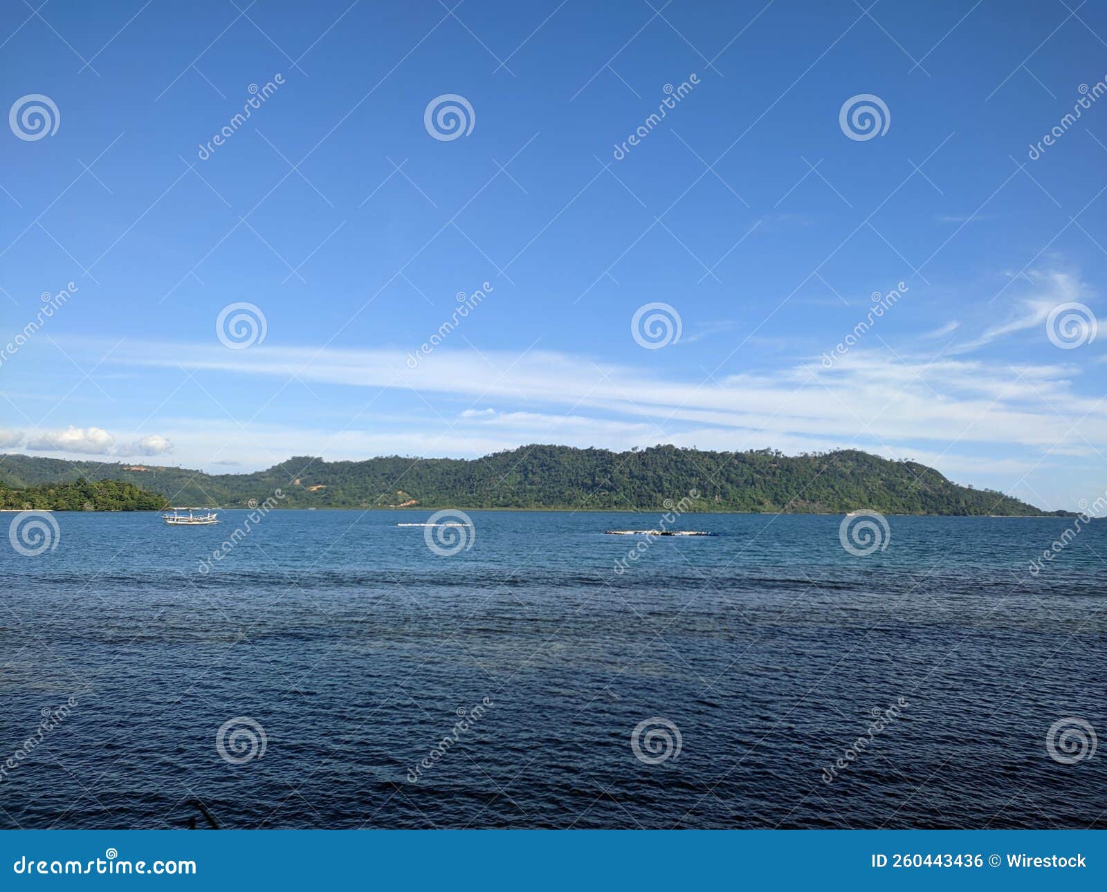Beautiful View of a Sea with Mountains Covered with Trees in the ...