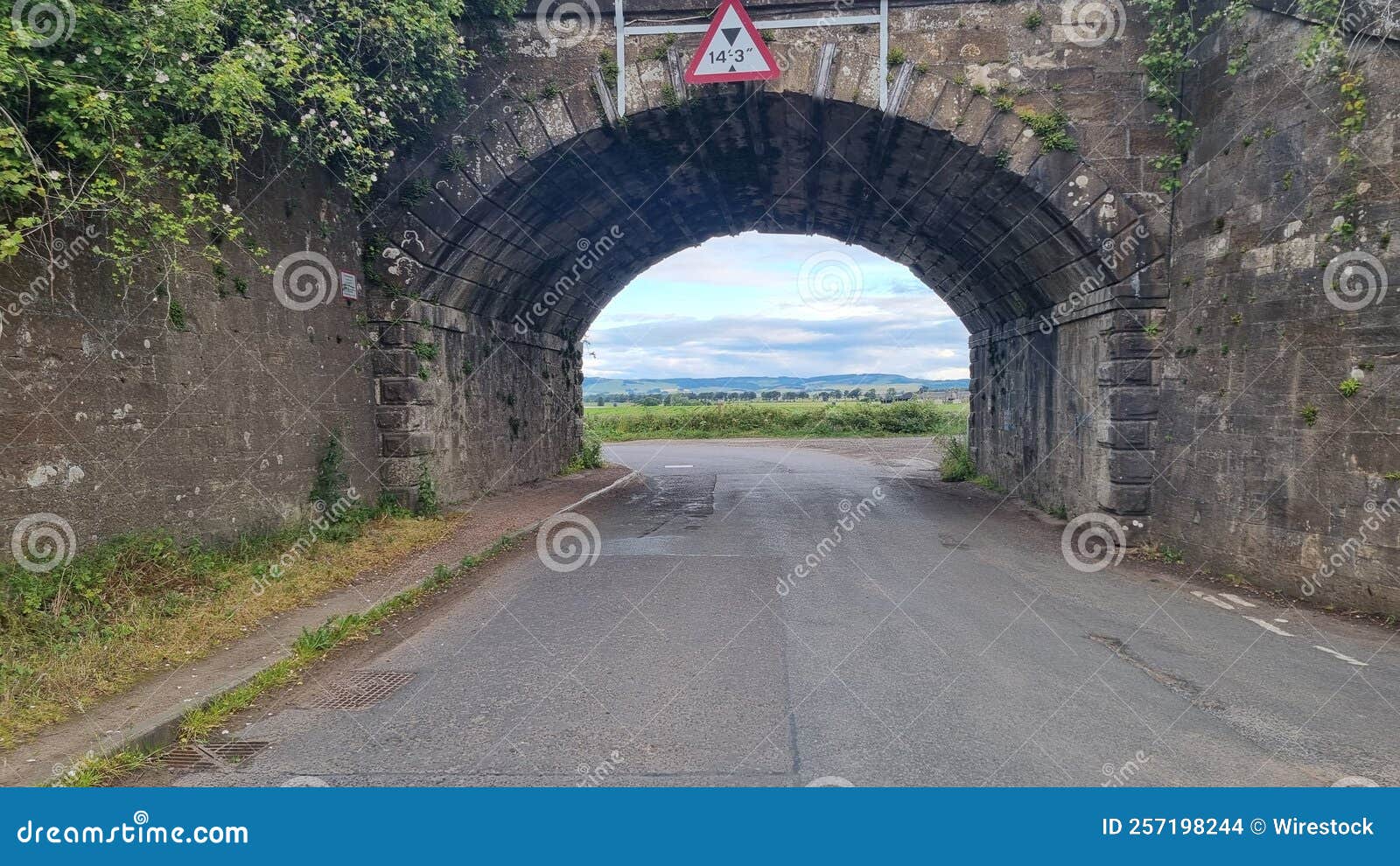 Beautiful View of a Stone Bridge Over an Empty Road Stock Photo - Image ...